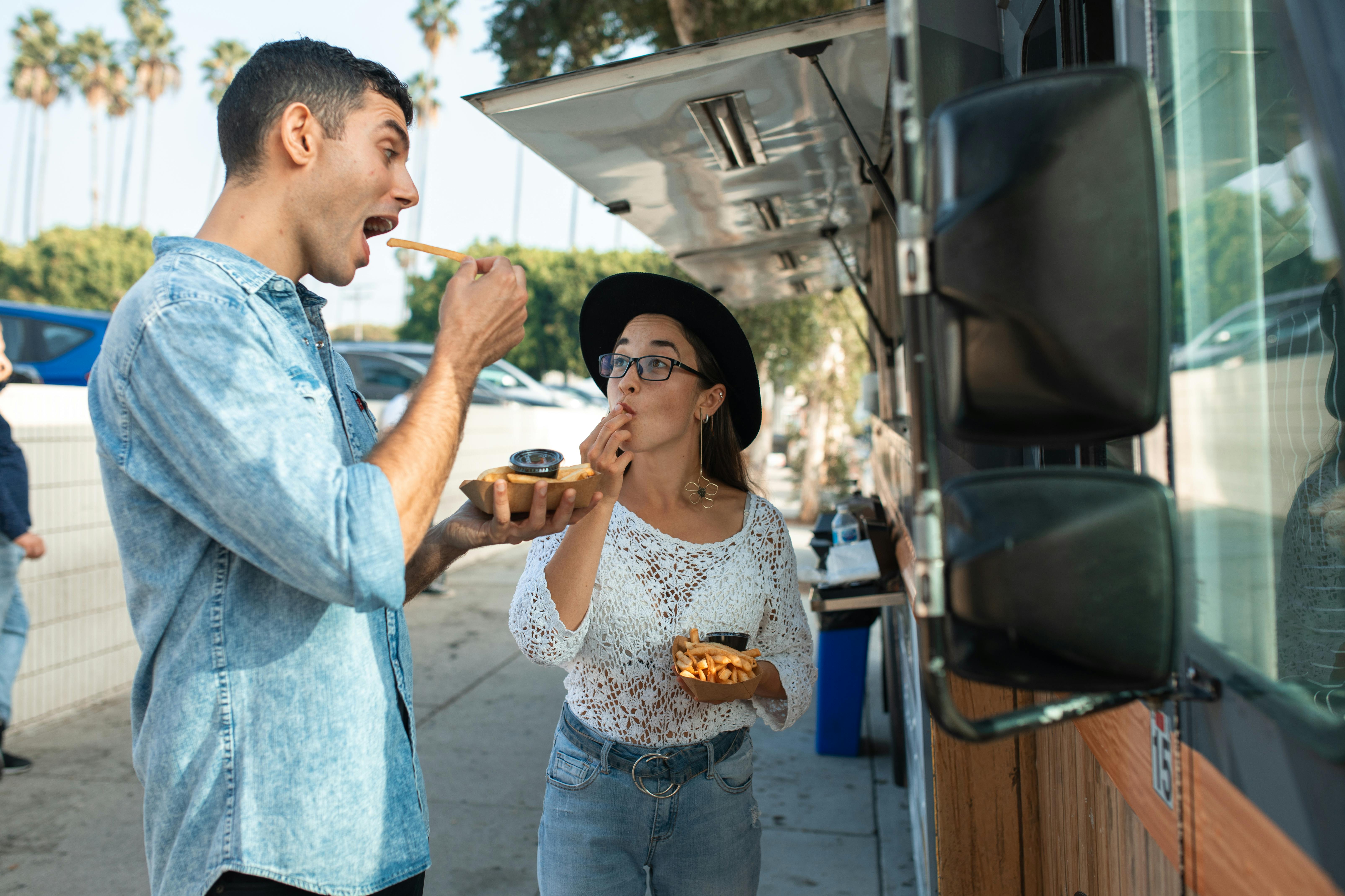 Friends ordering Food from a Food Truck · Free Stock Photo
