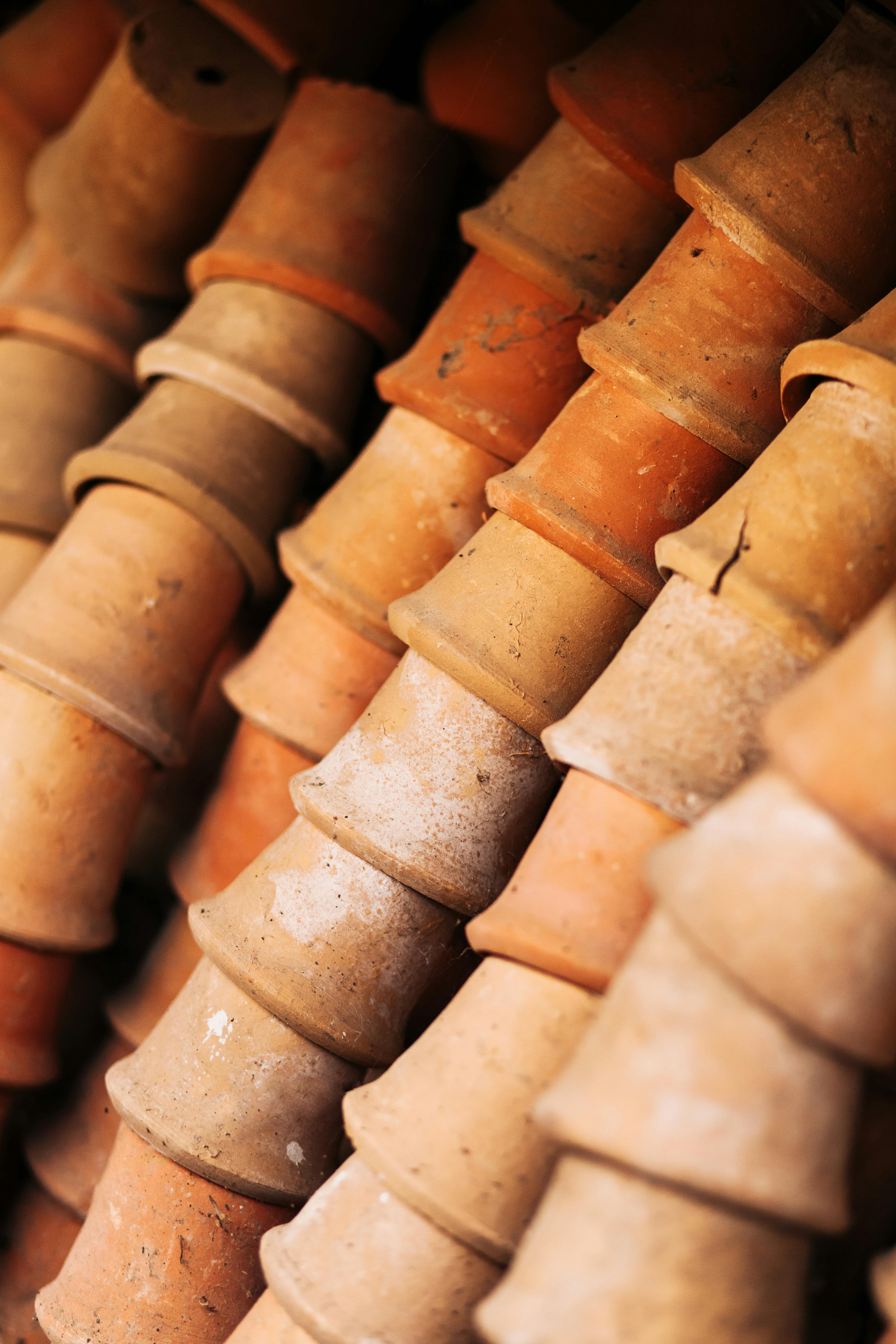 Close-up of Clay Pottery in Stacks · Free Stock Photo