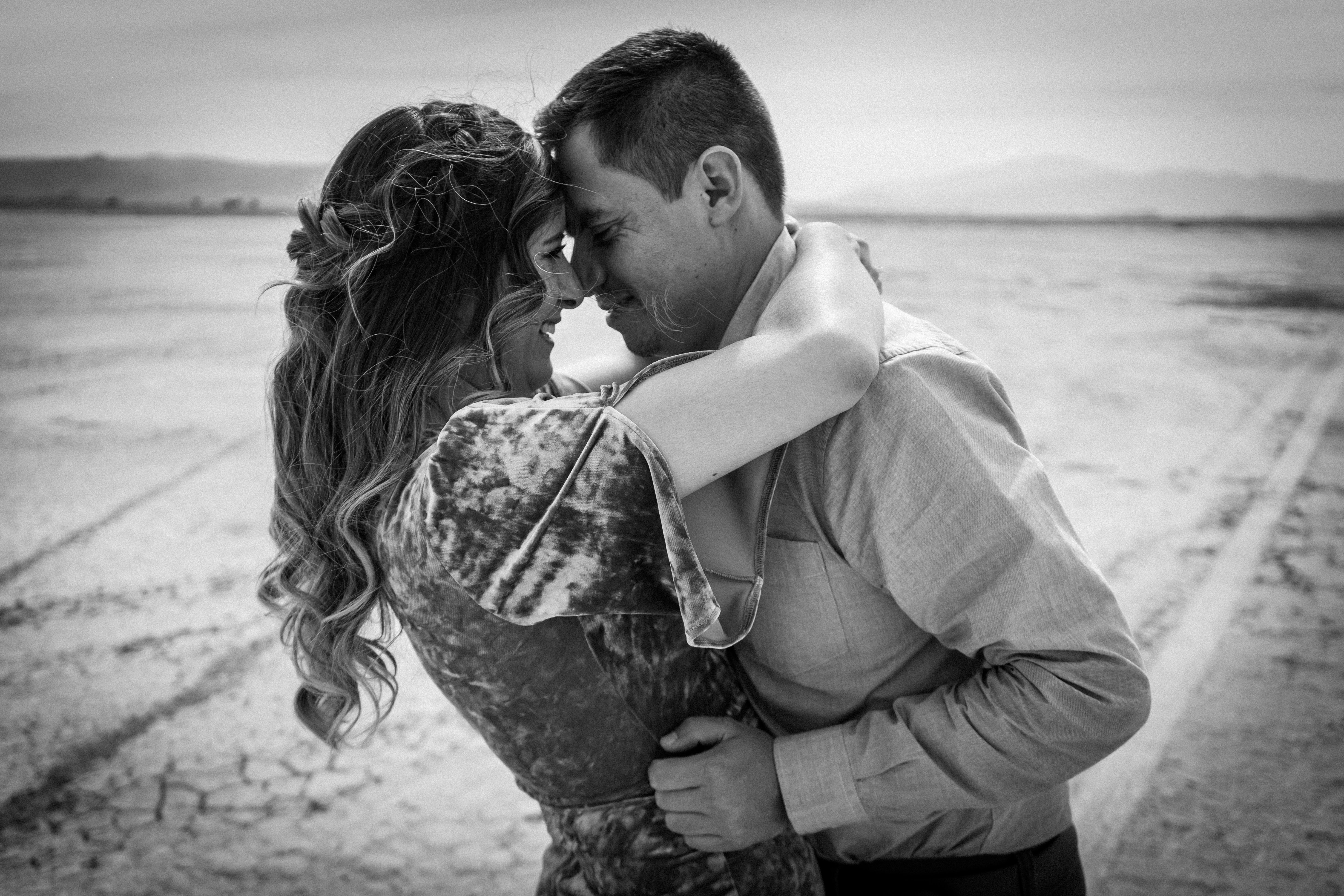 Grayscale Photo of a Romantic Couple Face to Face · Free Stock Photo