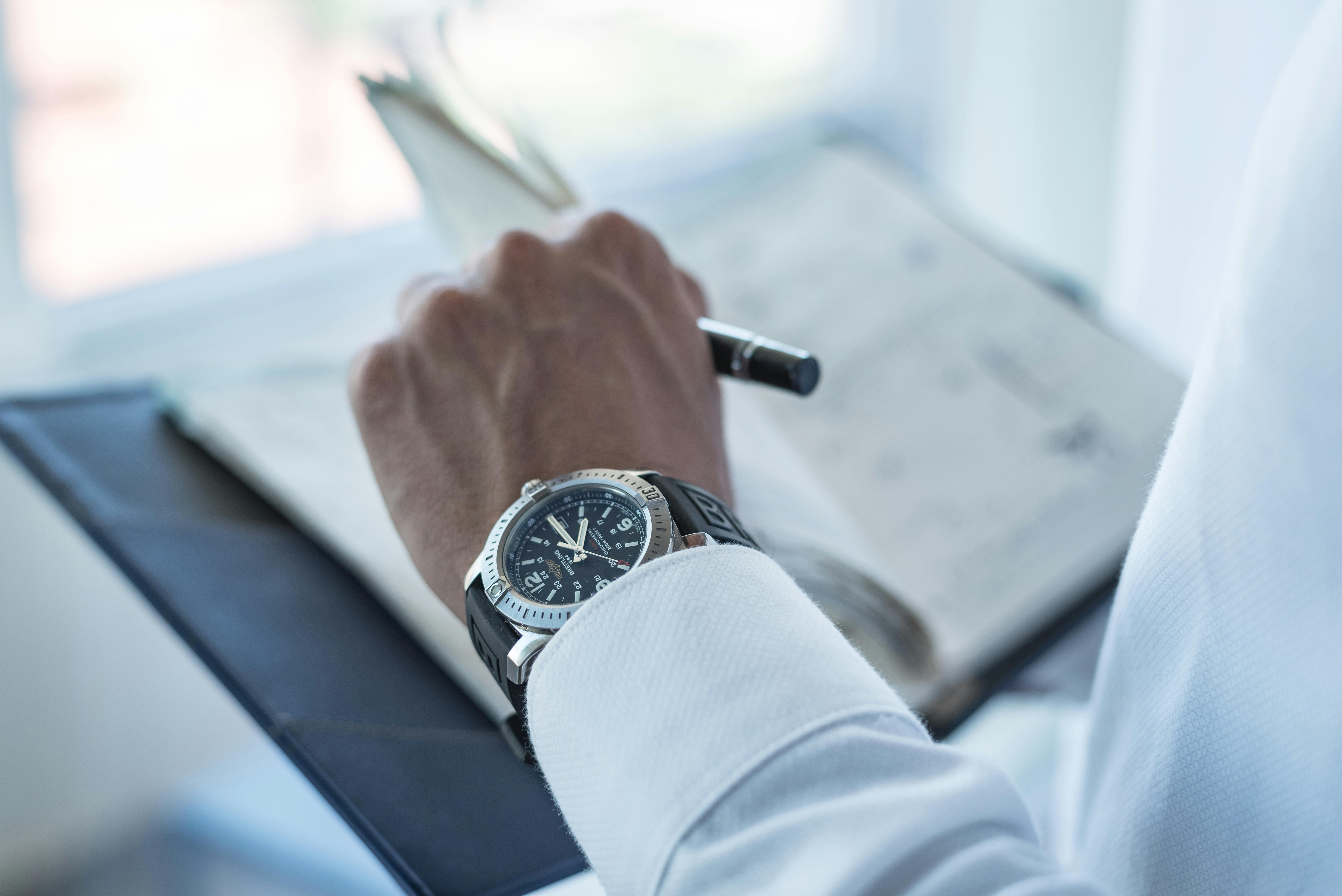 Person Wearing Silver and Black Watch · Free Stock Photo