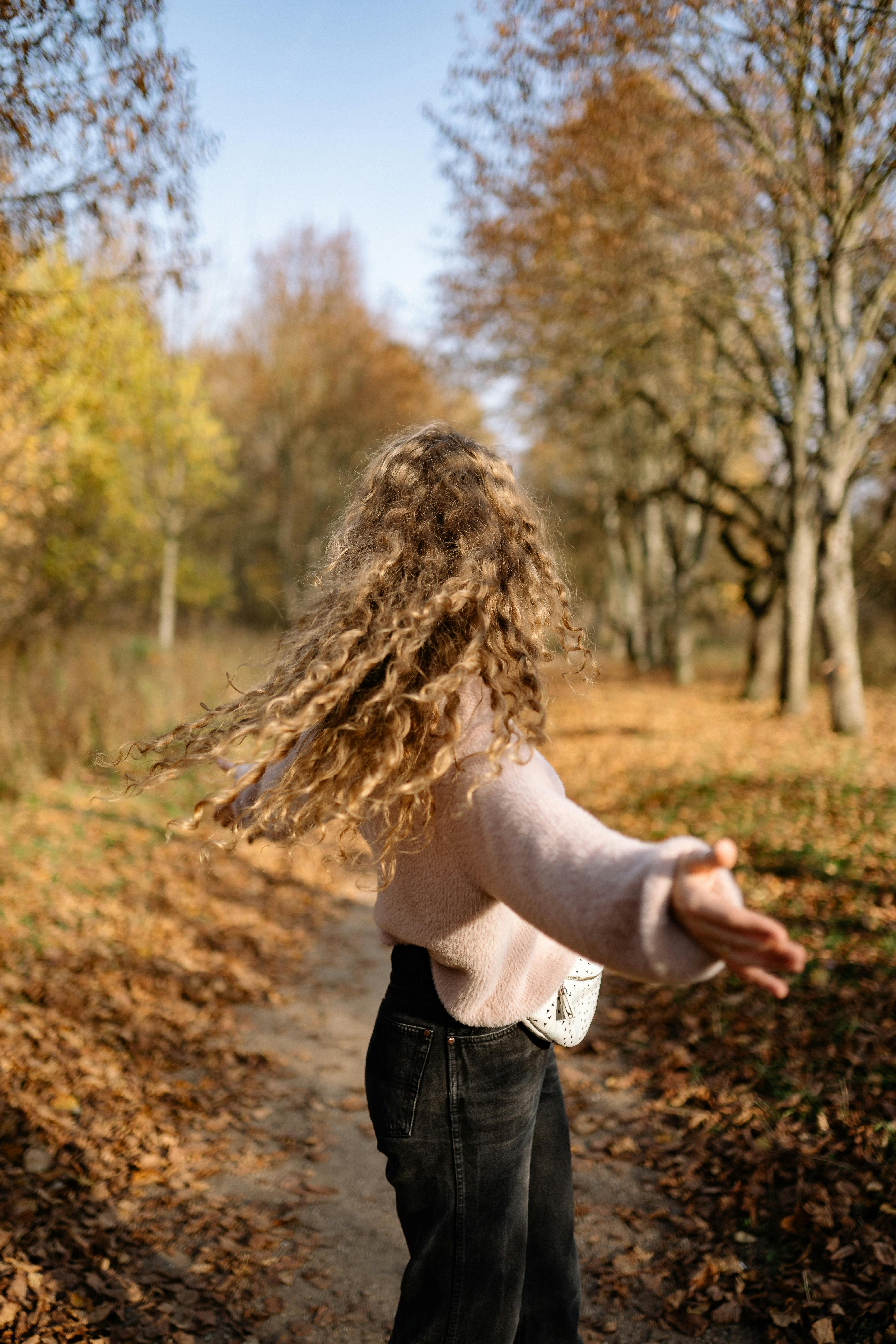 Woman in Black Denim Jeans Standing on the Forest Pathway · Free Stock ...