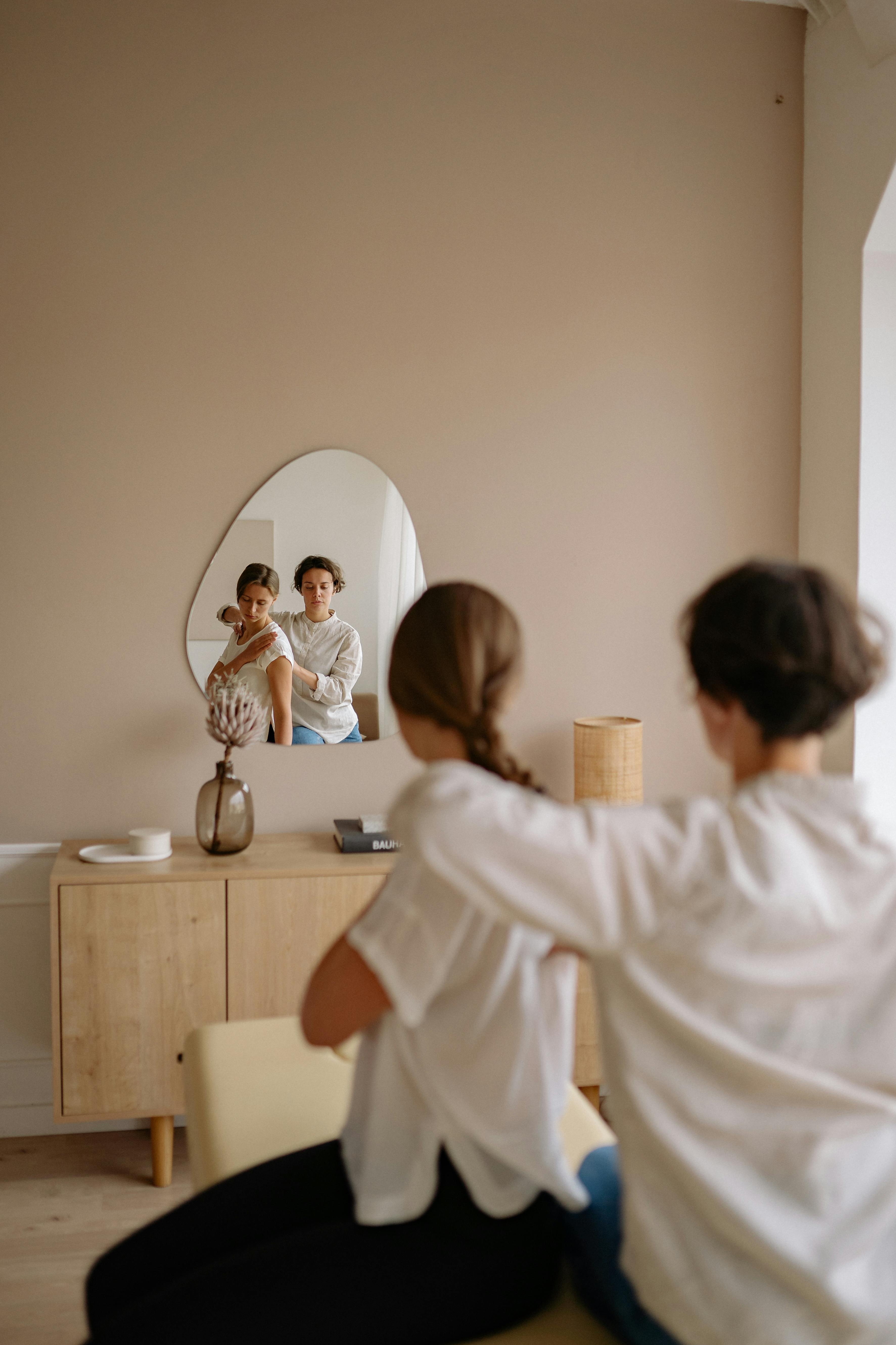 Reflection of a Therapist and a Client on a Mirror · Free Stock Photo