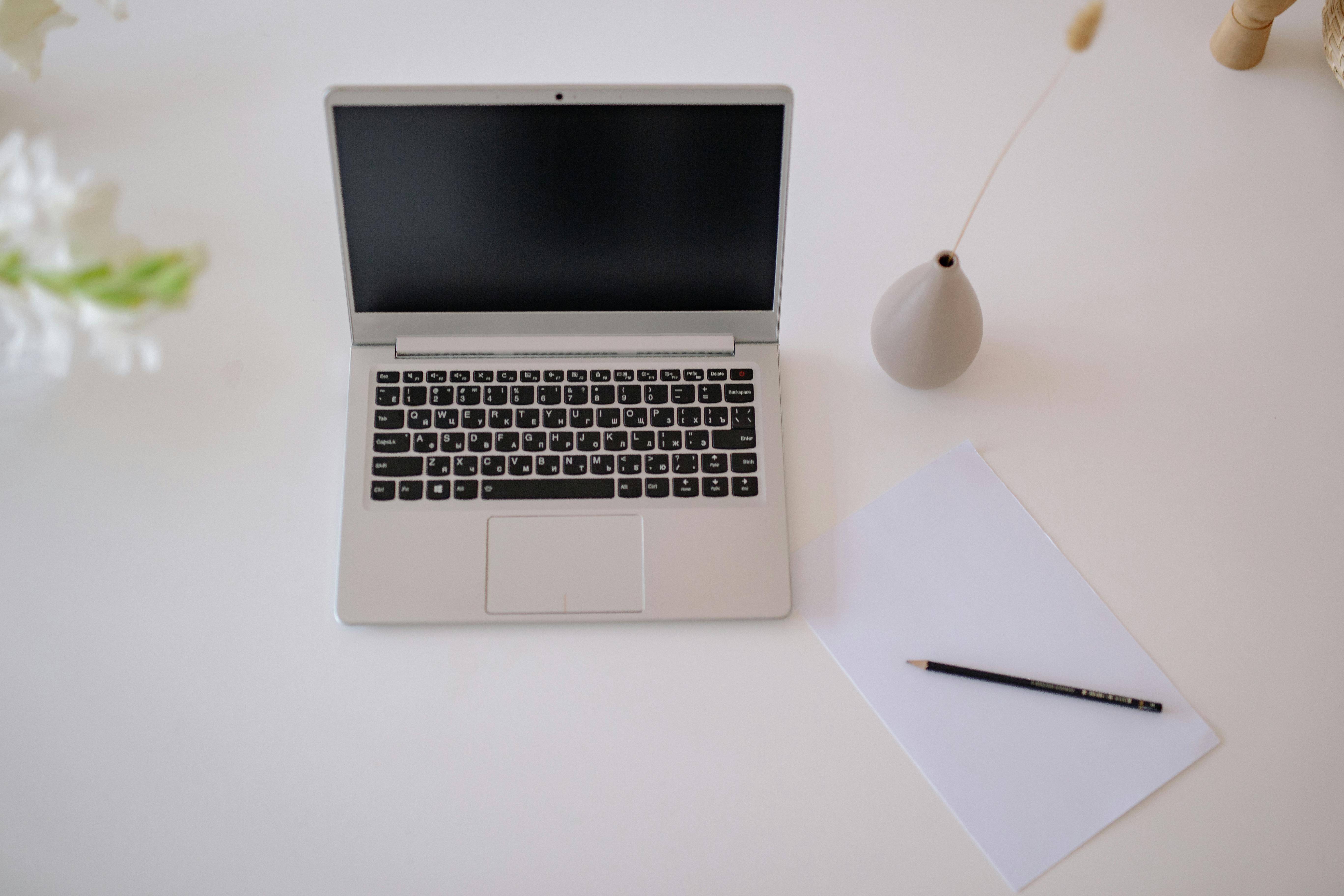 A Paper and Pencil on the Table · Free Stock Photo