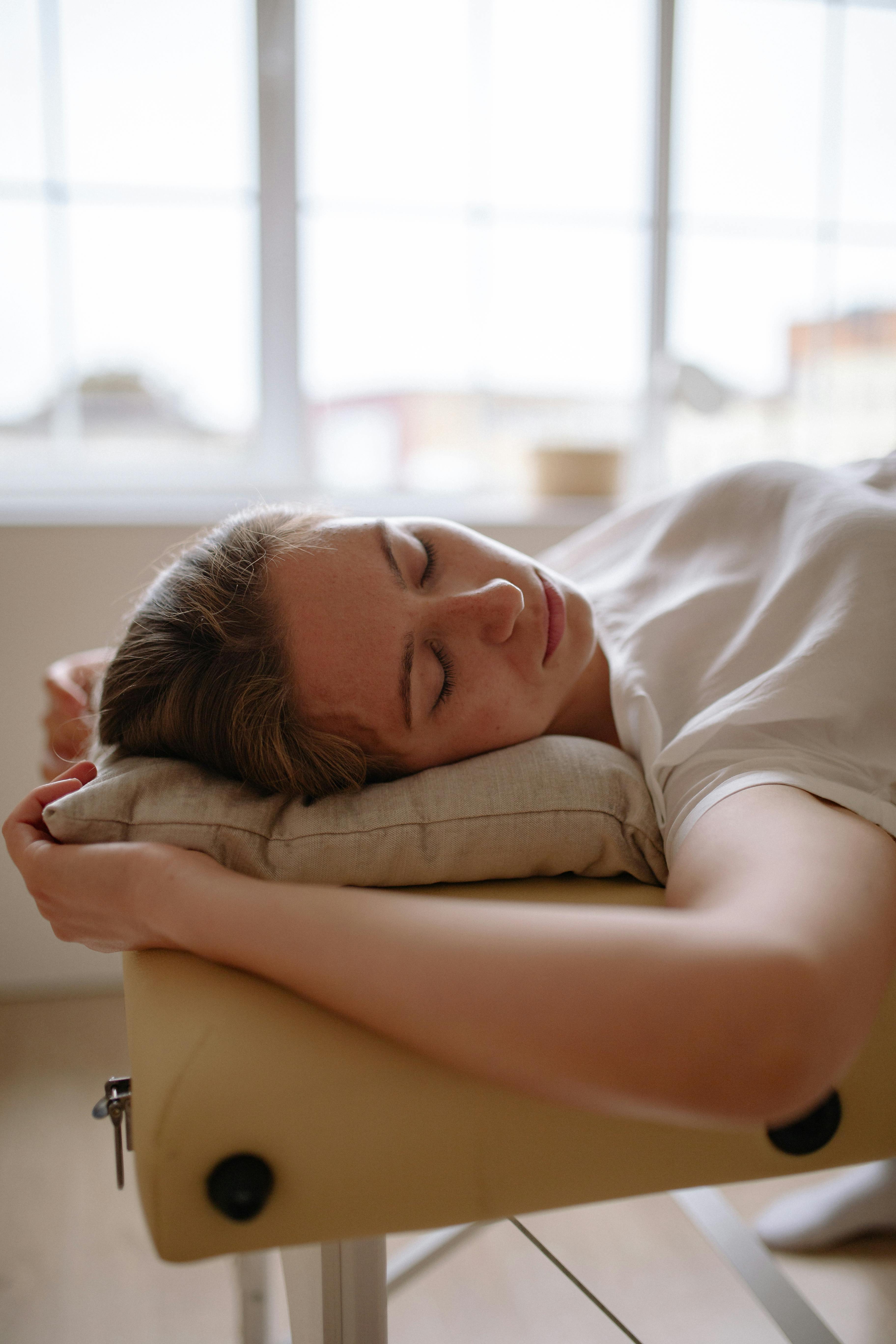 Woman Lying Down on Floor Relaxing and Meditating · Free Stock Photo