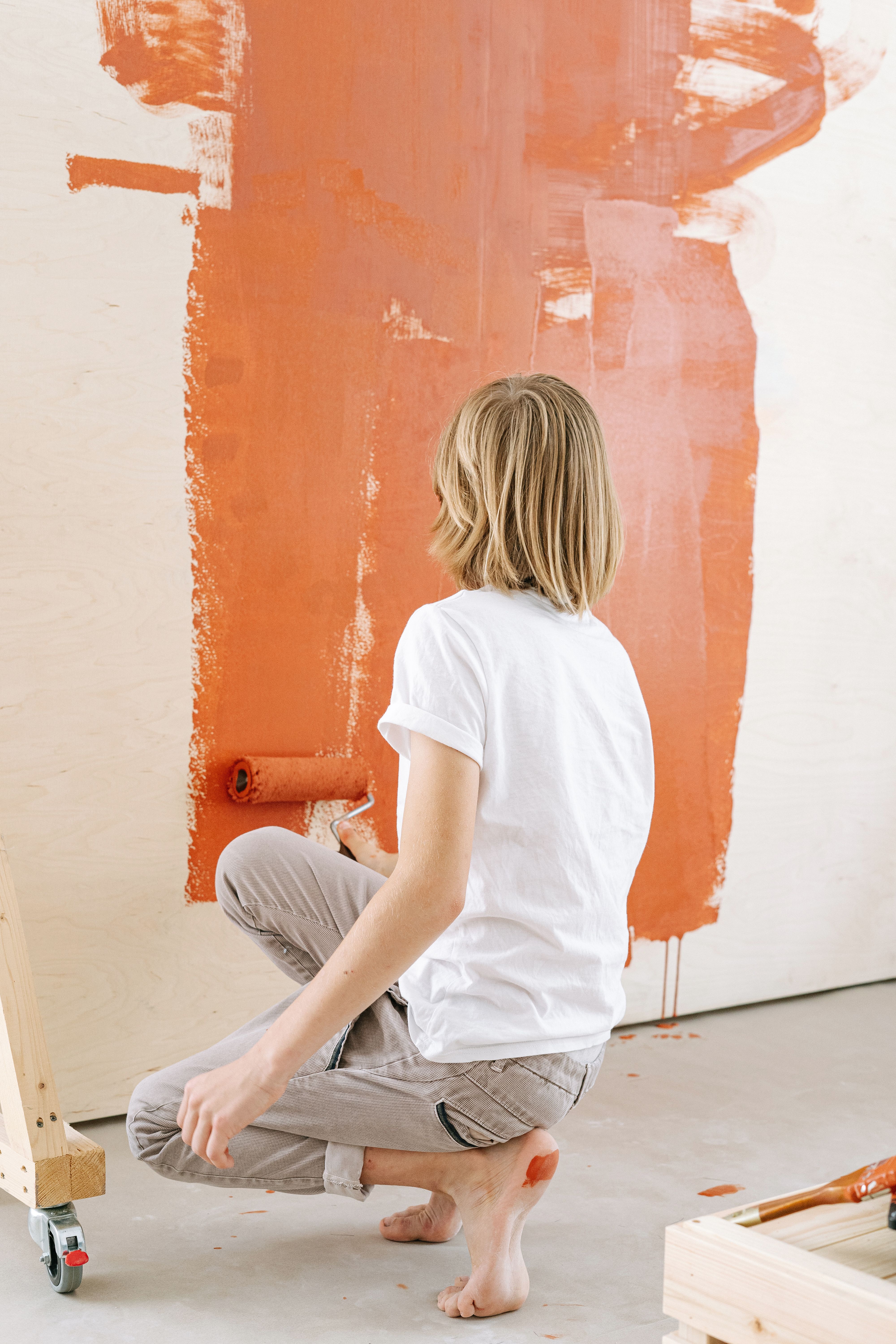 A Boy Using a Paint Roller · Free Stock Photo