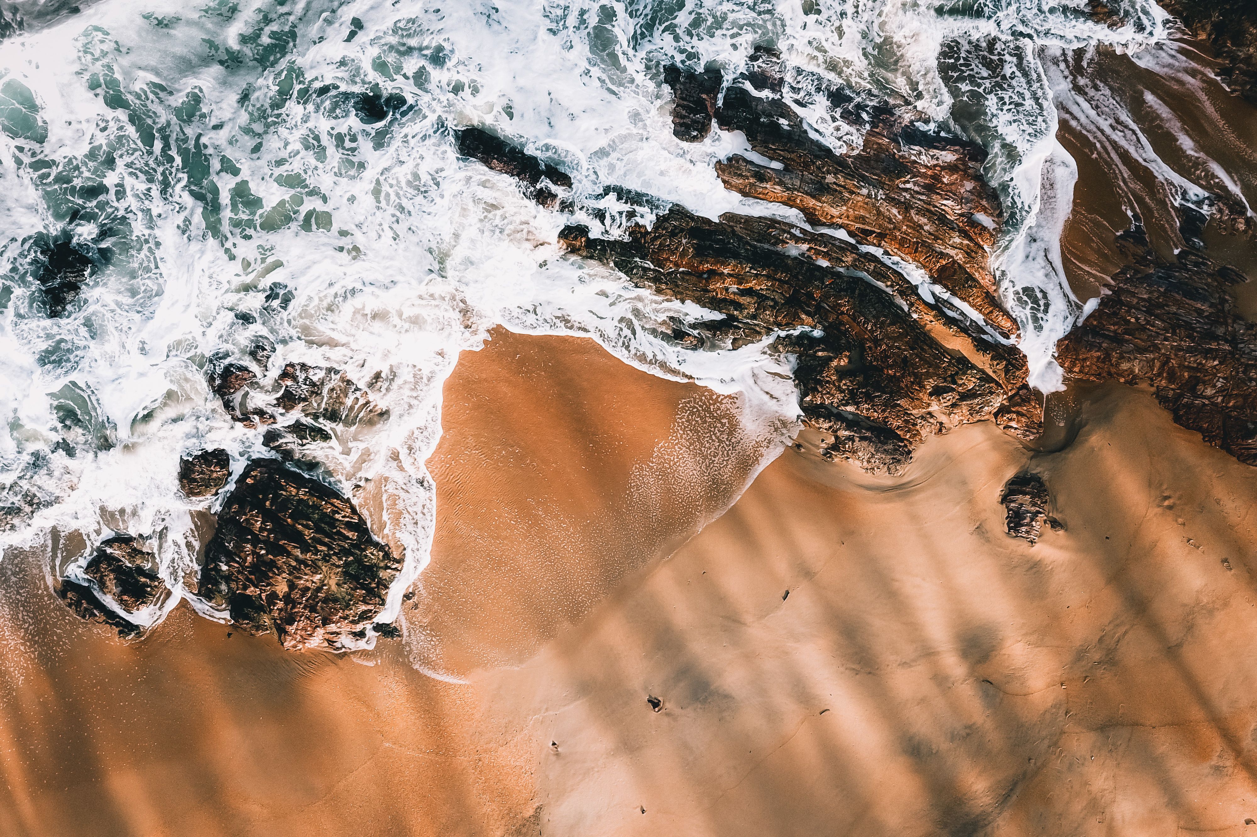 Sandy ground with seashells and stones · Free Stock Photo