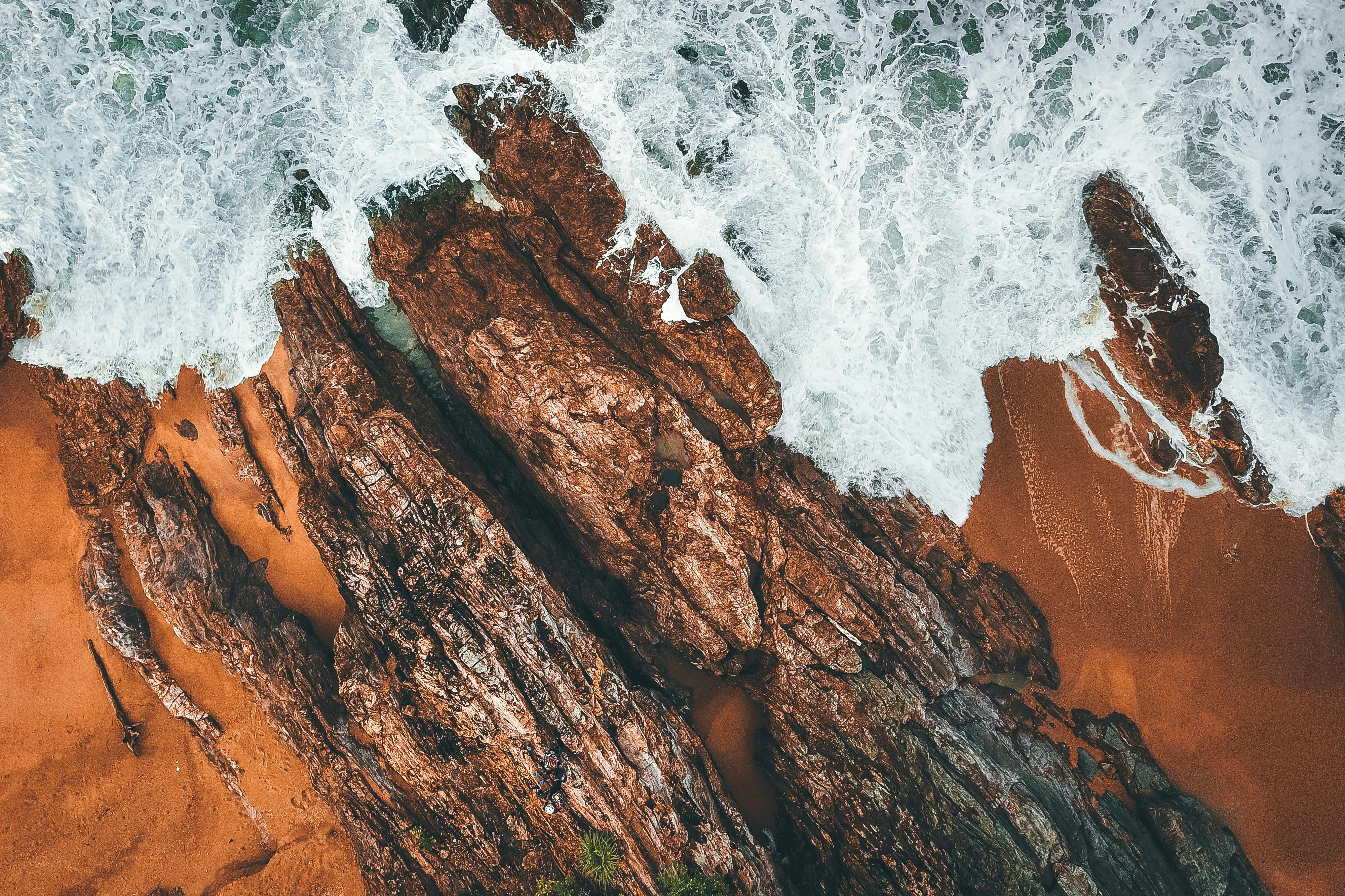Sandy ground with seashells and stones · Free Stock Photo
