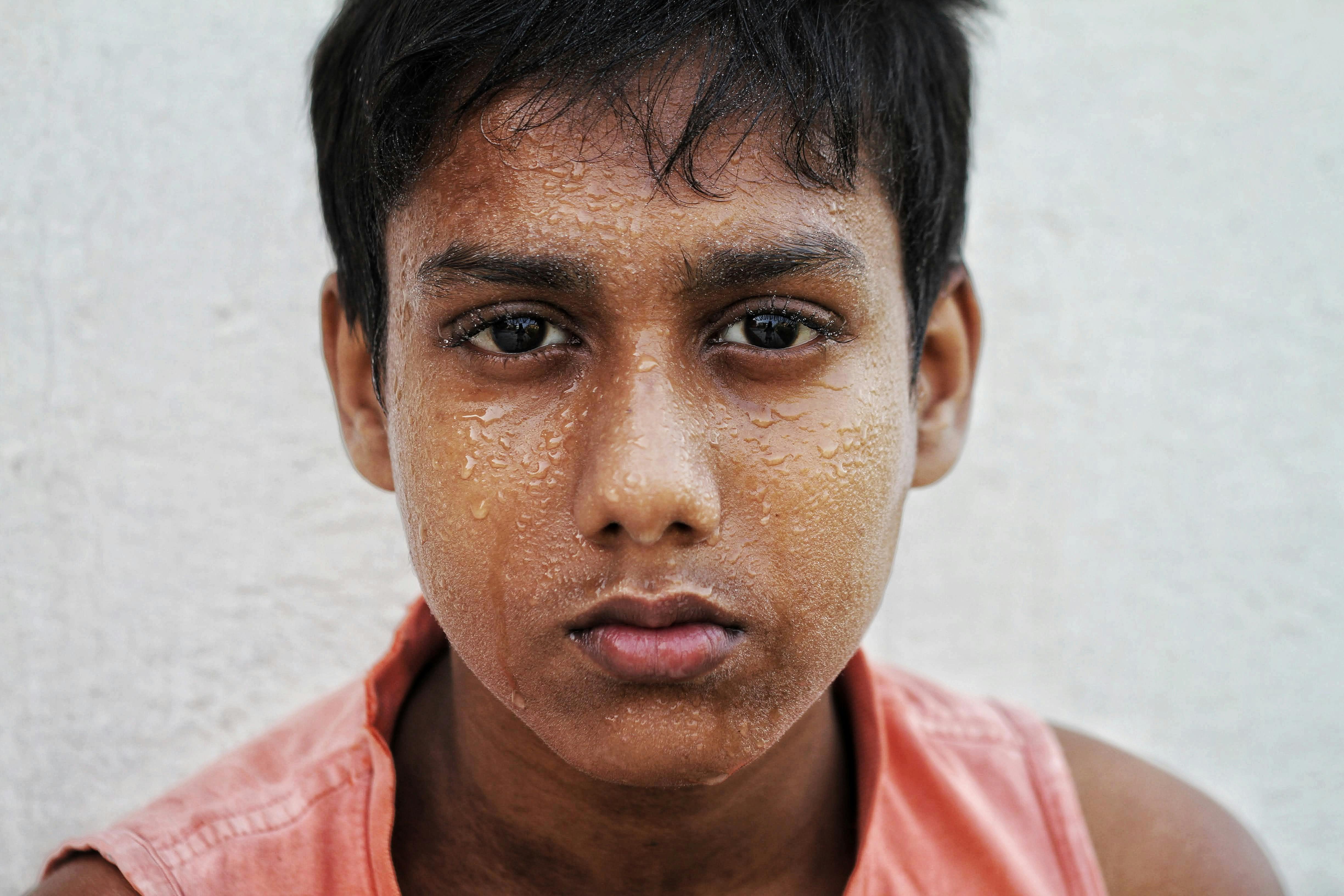 Close Up Photo of a Woman Sweating · Free Stock Photo