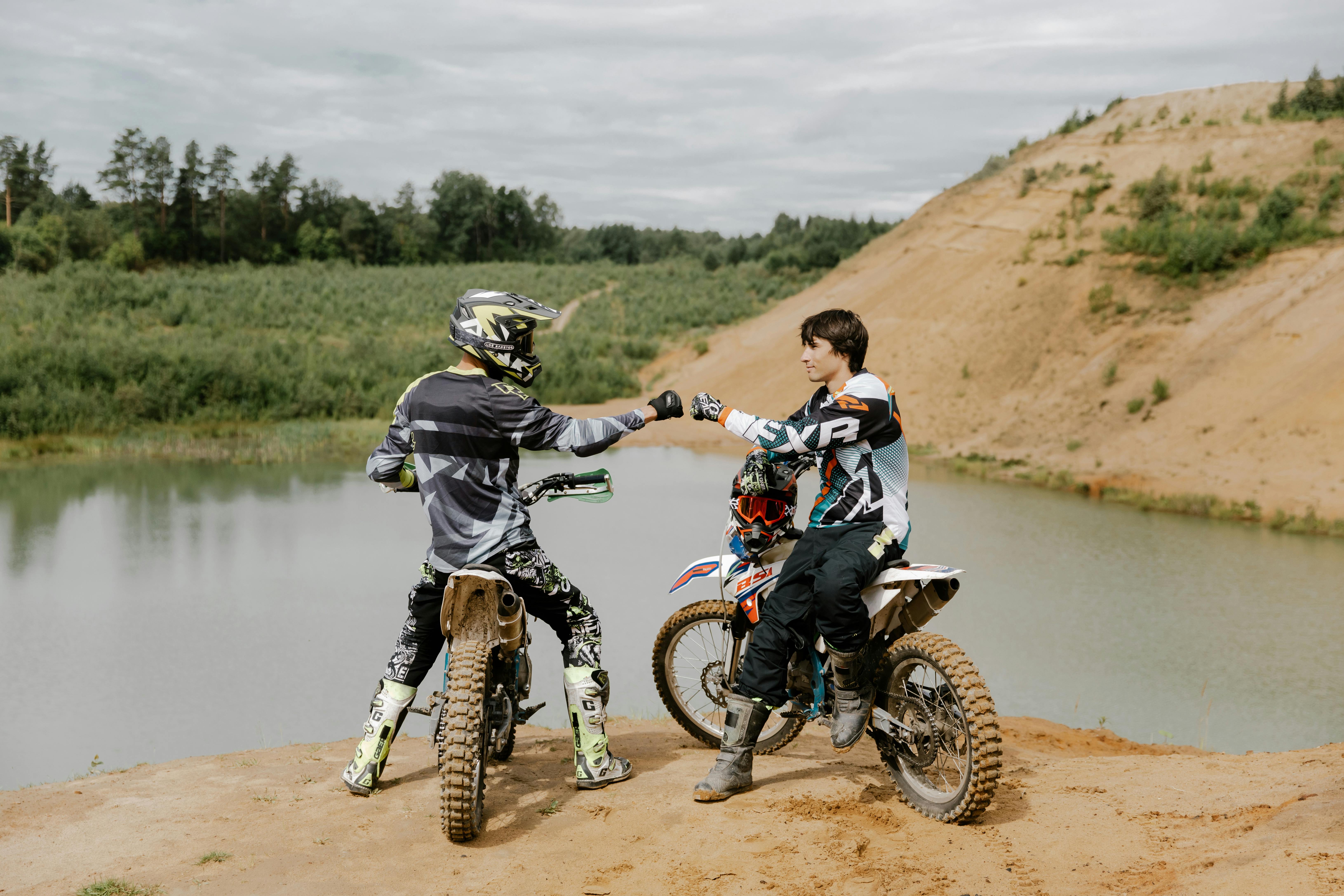 Two Men Sitting on the Motocross · Free Stock Photo