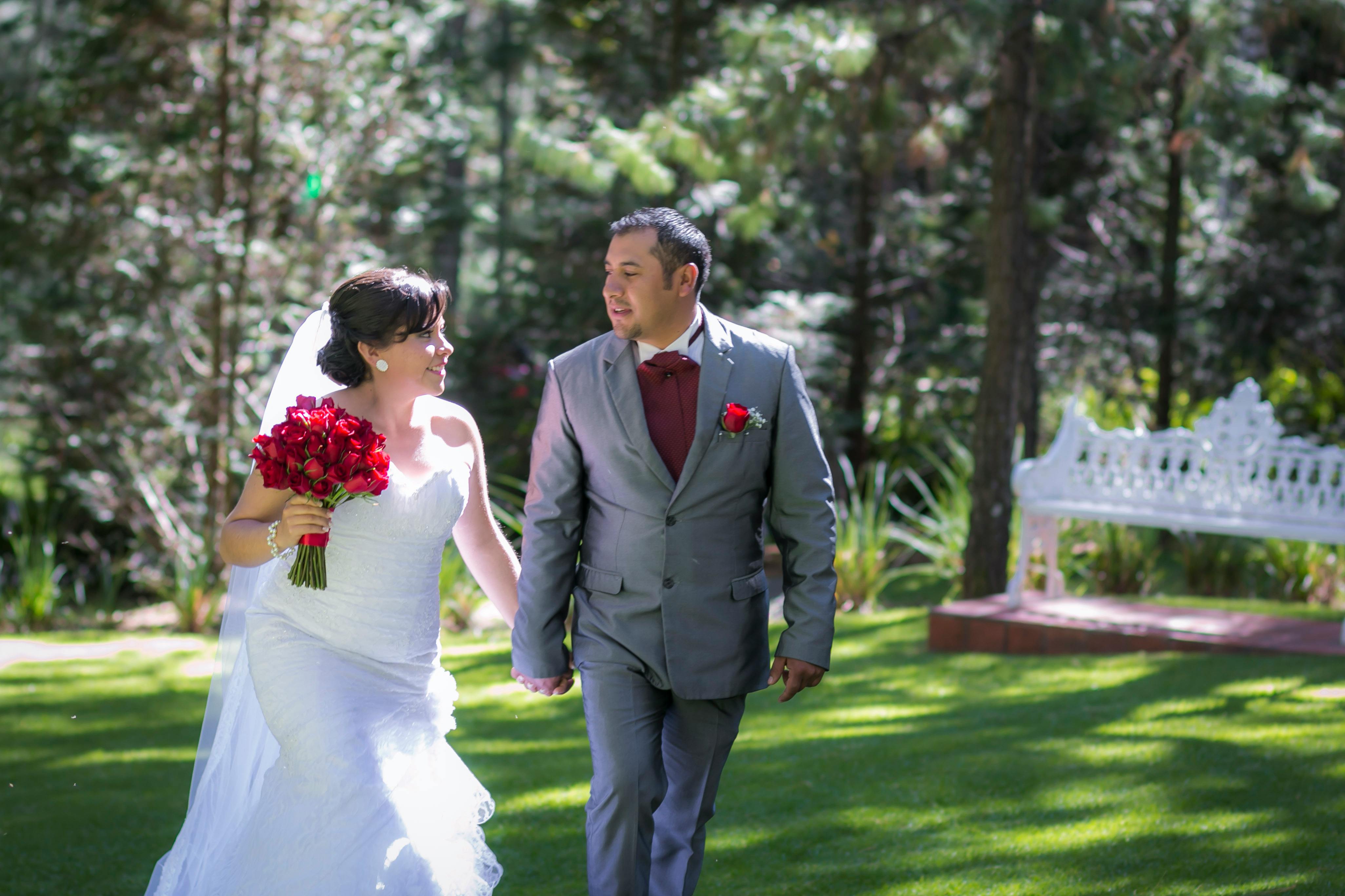 A Newlywed Couple Walking in between People Holding Sparklers · Free ...