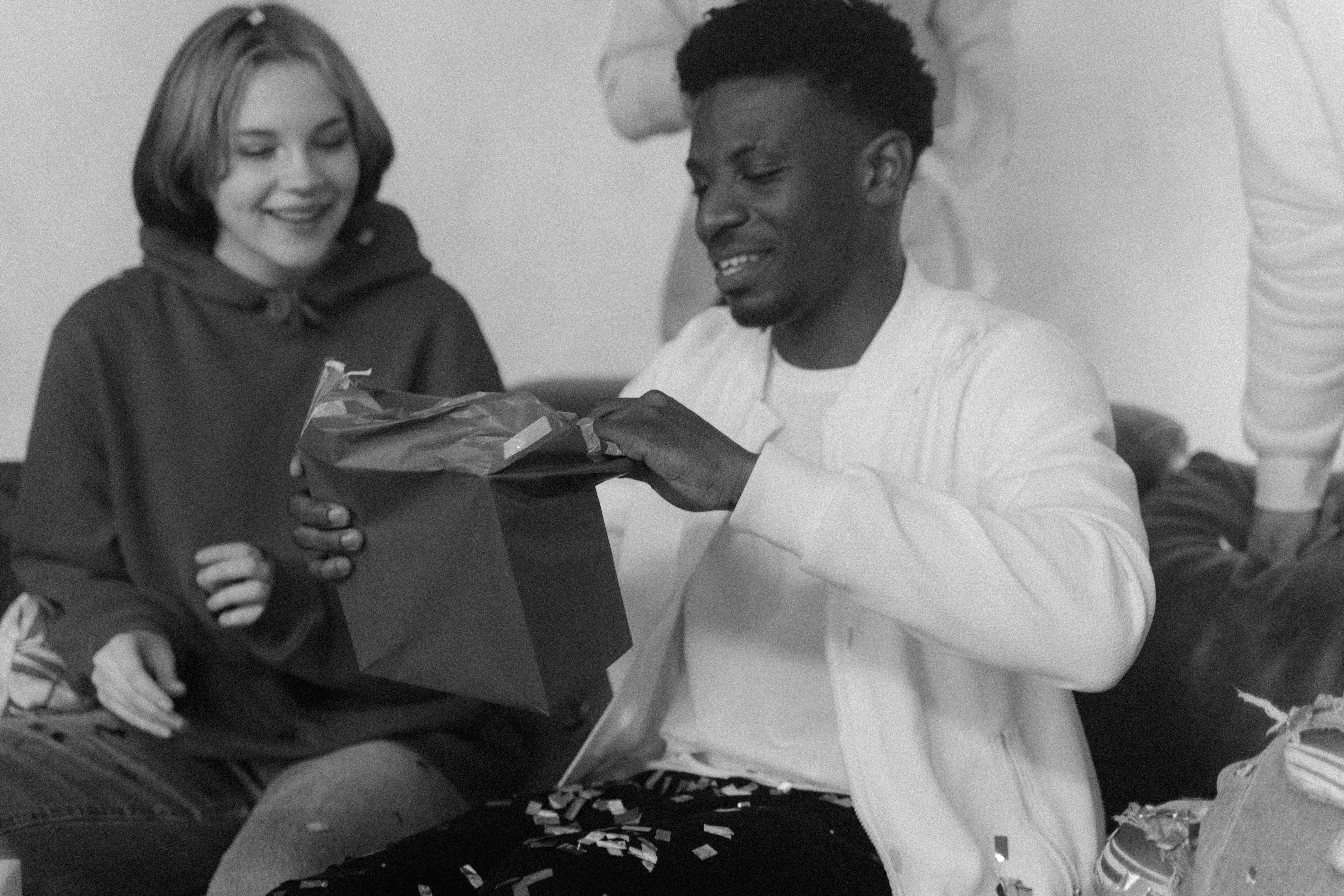 Man Opening a Gift · Free Stock Photo