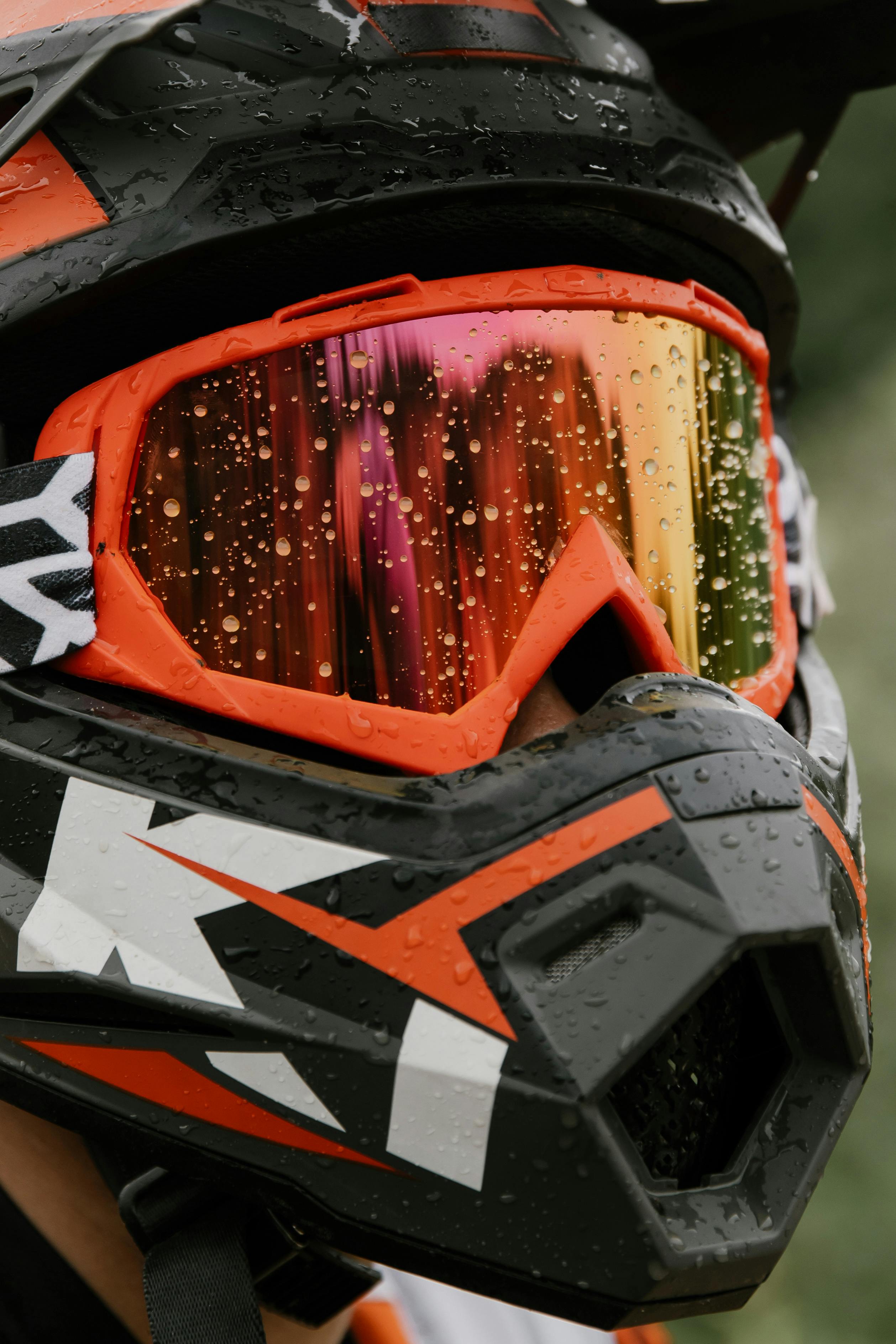 Helmets and Tires on Wall · Free Stock Photo