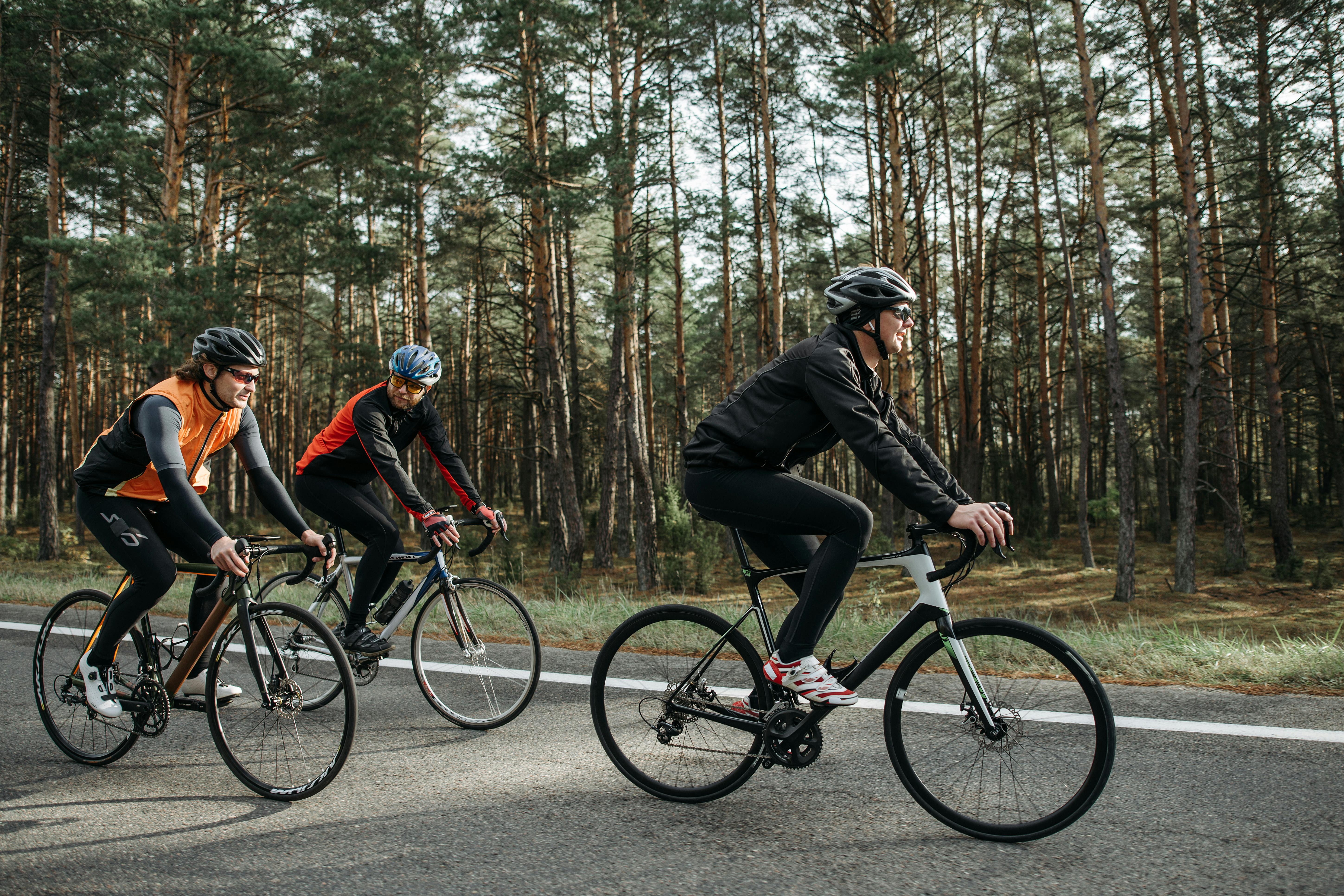 Men riding Bicycle on Road · Free Stock Photo