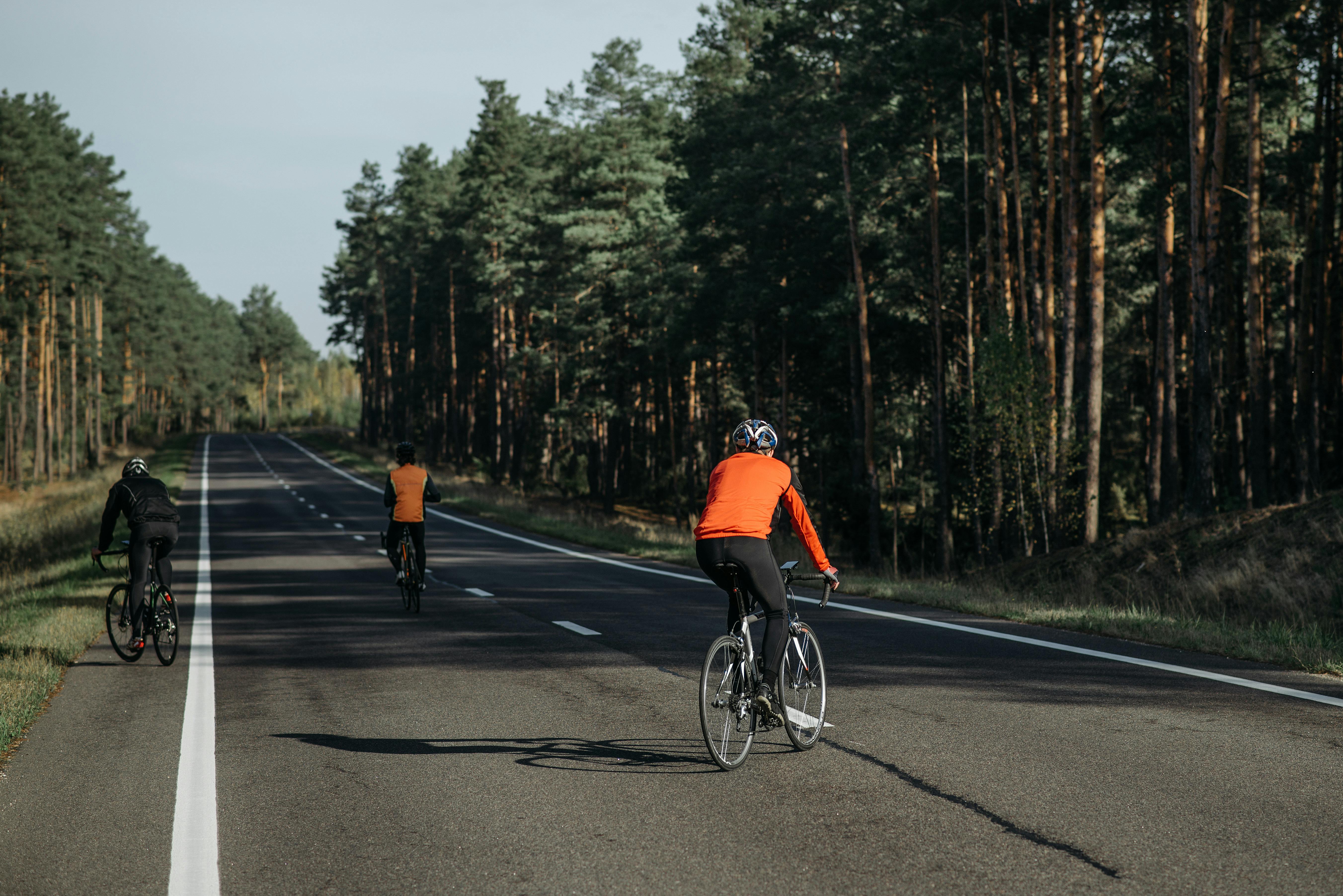 People Riding Bicycle on Road · Free Stock Photo