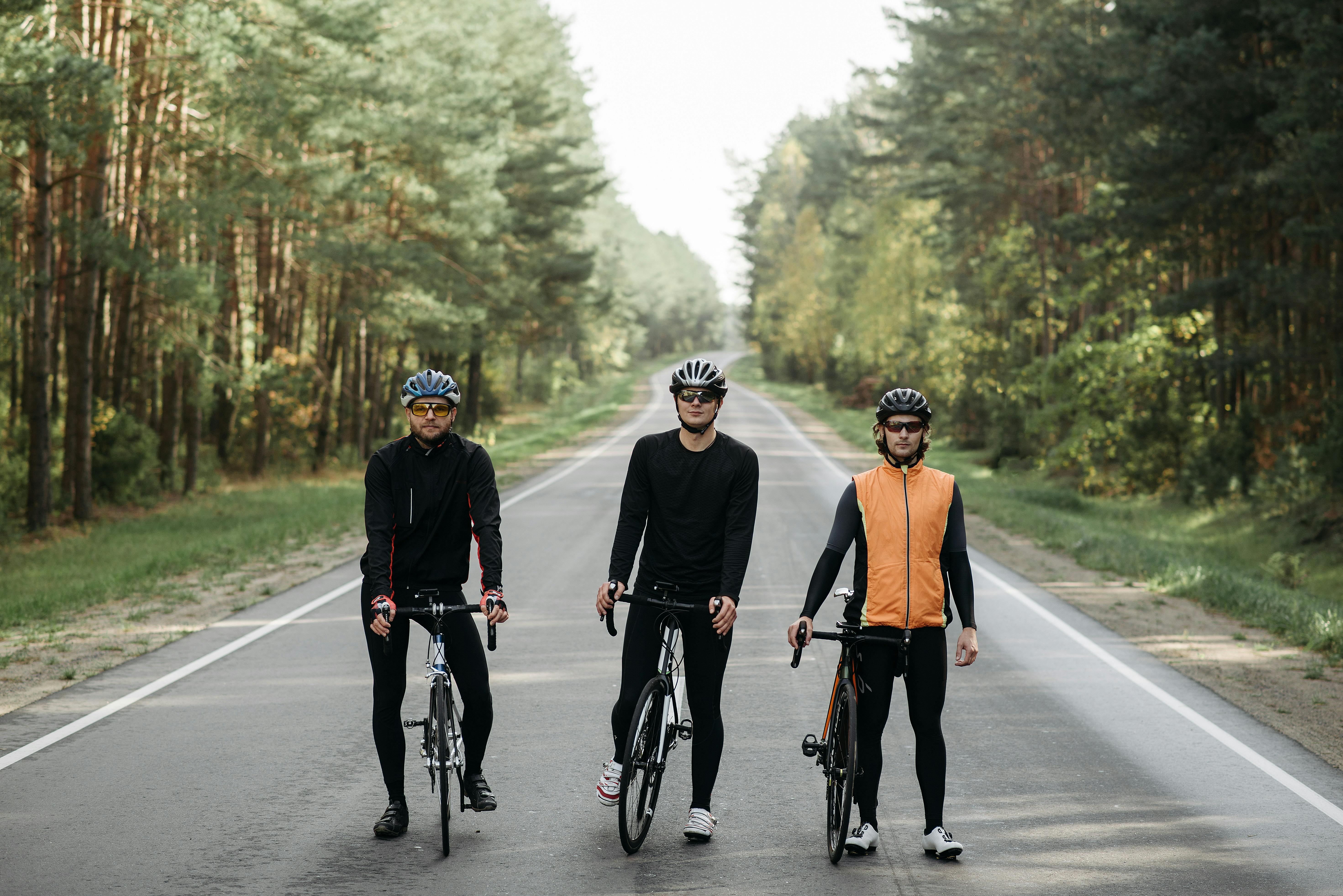 Men Riding Bicycle on the Road · Free Stock Photo
