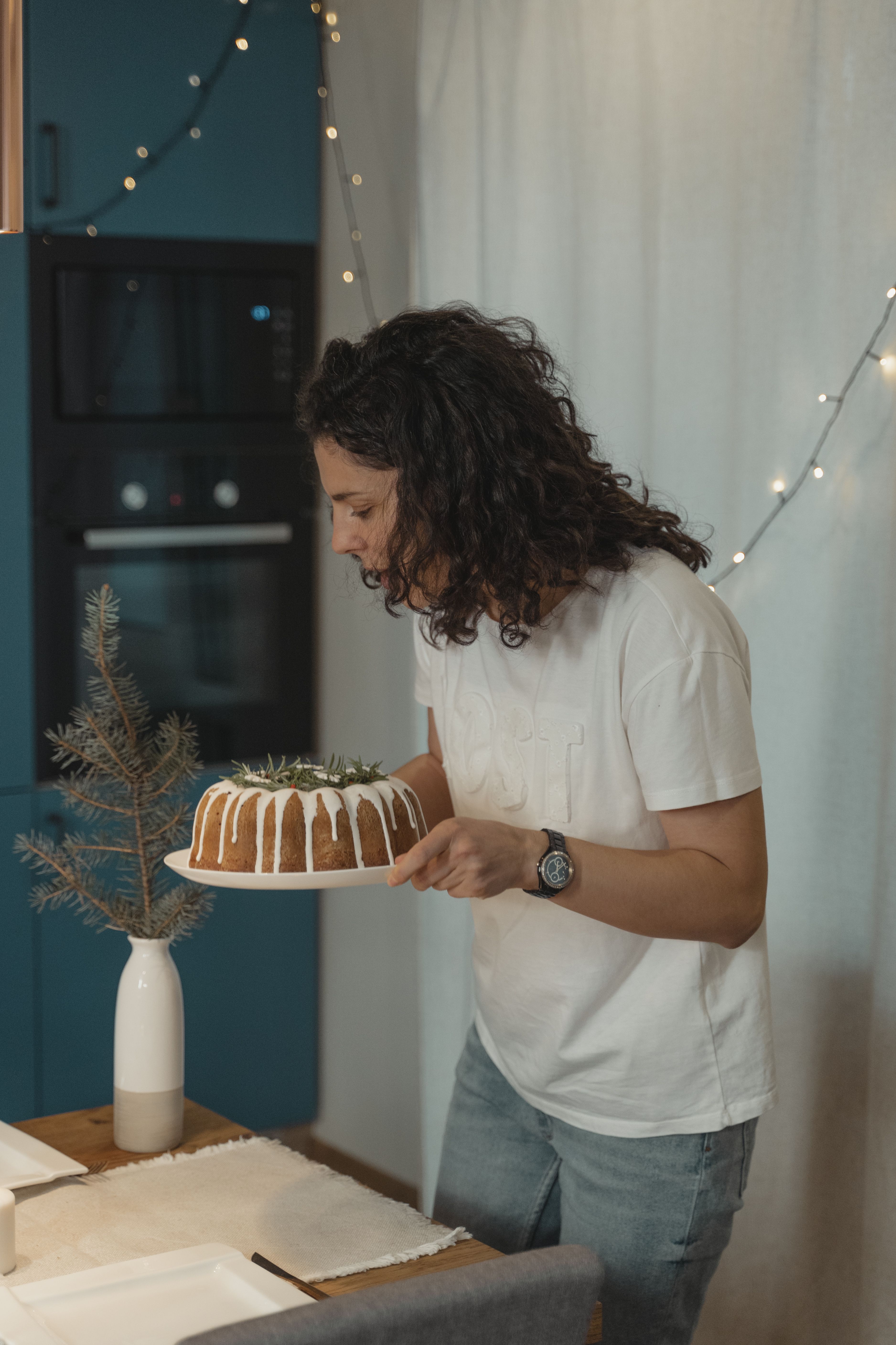Woman in White Shirt Carrying Cake · Free Stock Photo