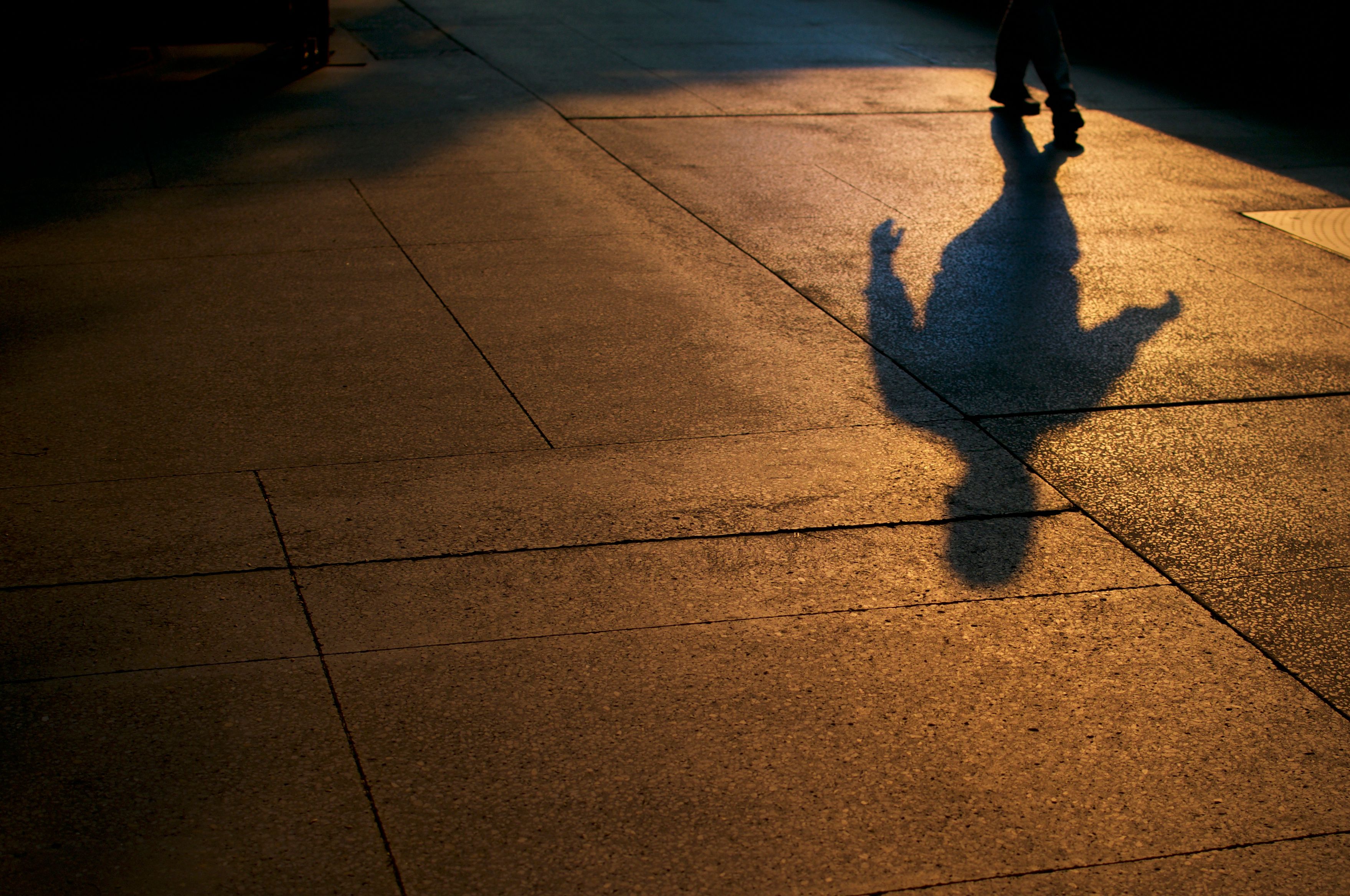 Photo of Person Walking on Pavement · Free Stock Photo