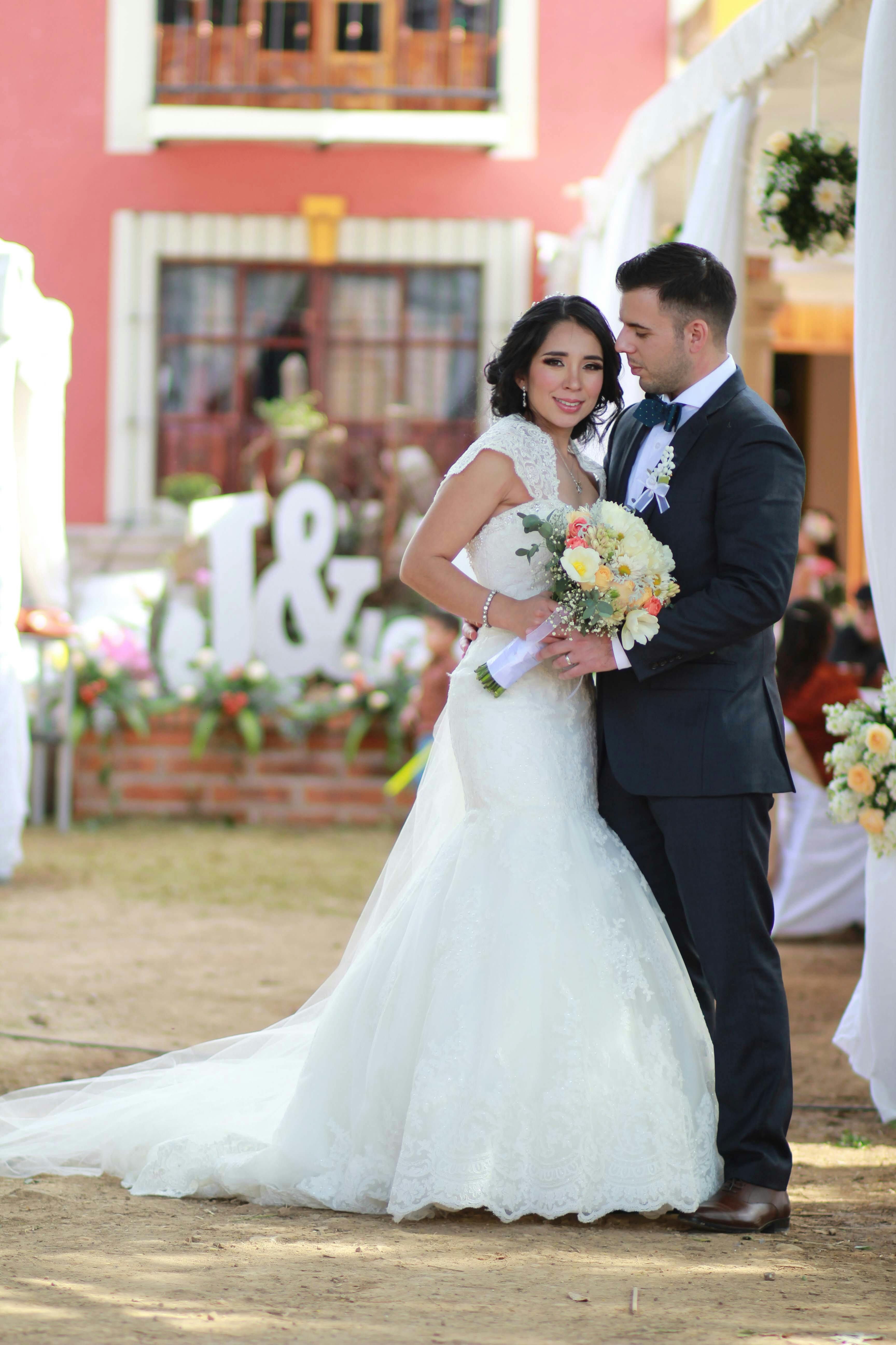 Little bride and groom in bright hall · Free Stock Photo