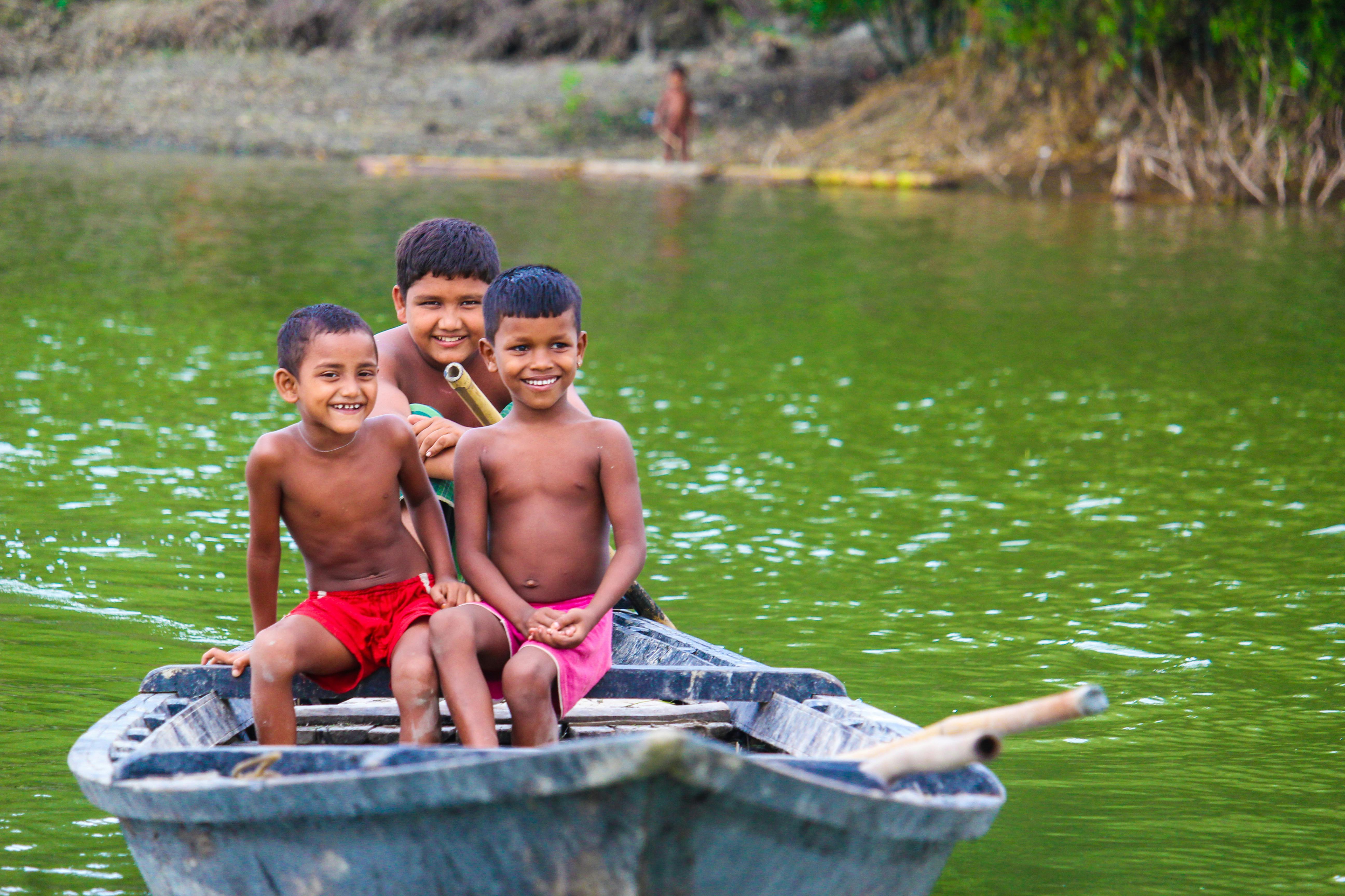 Boys Riding a Boat · Free Stock Photo