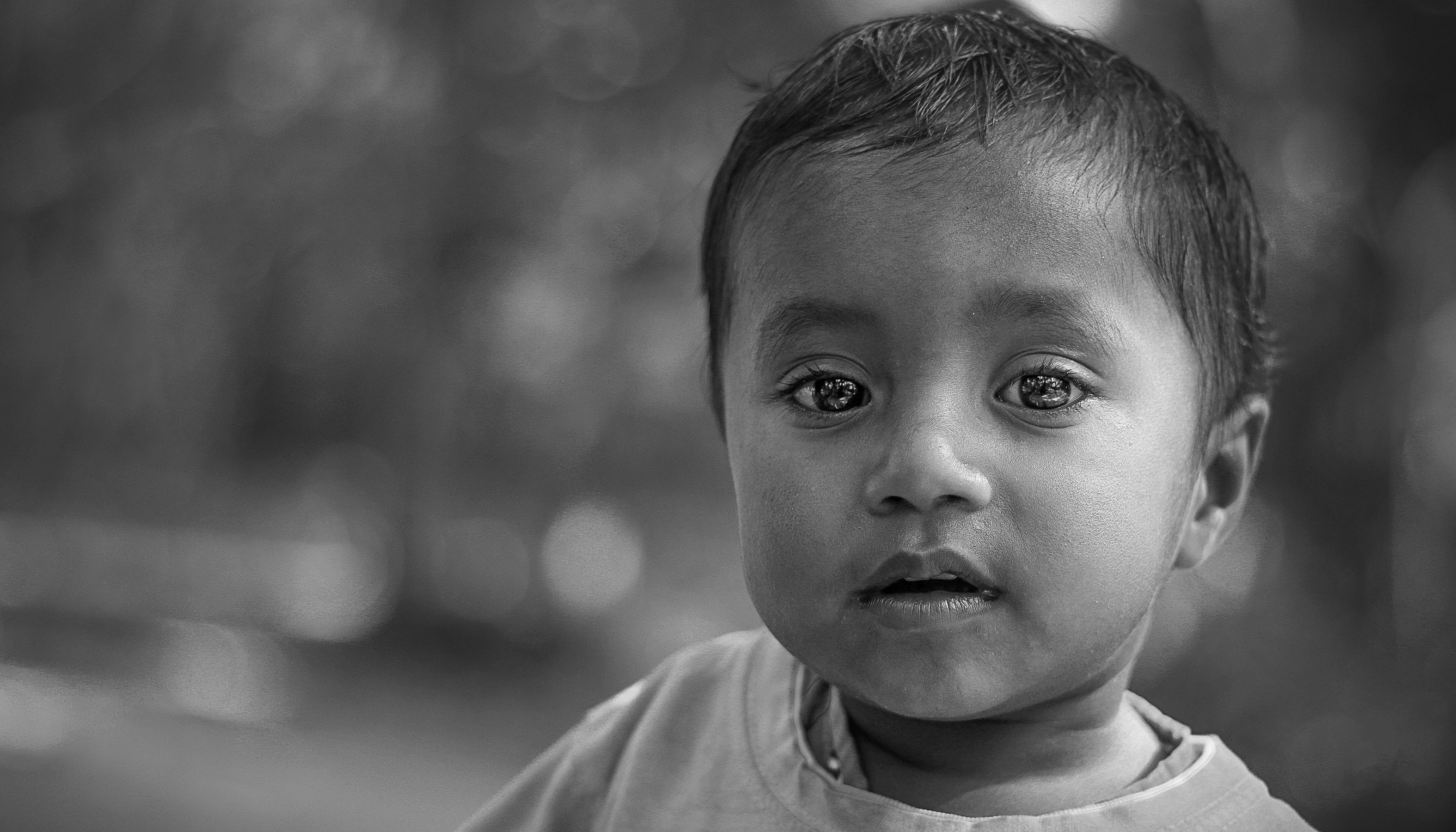 Boy in Black V-neck Shirt With Looking Straight to the Camera With a ...
