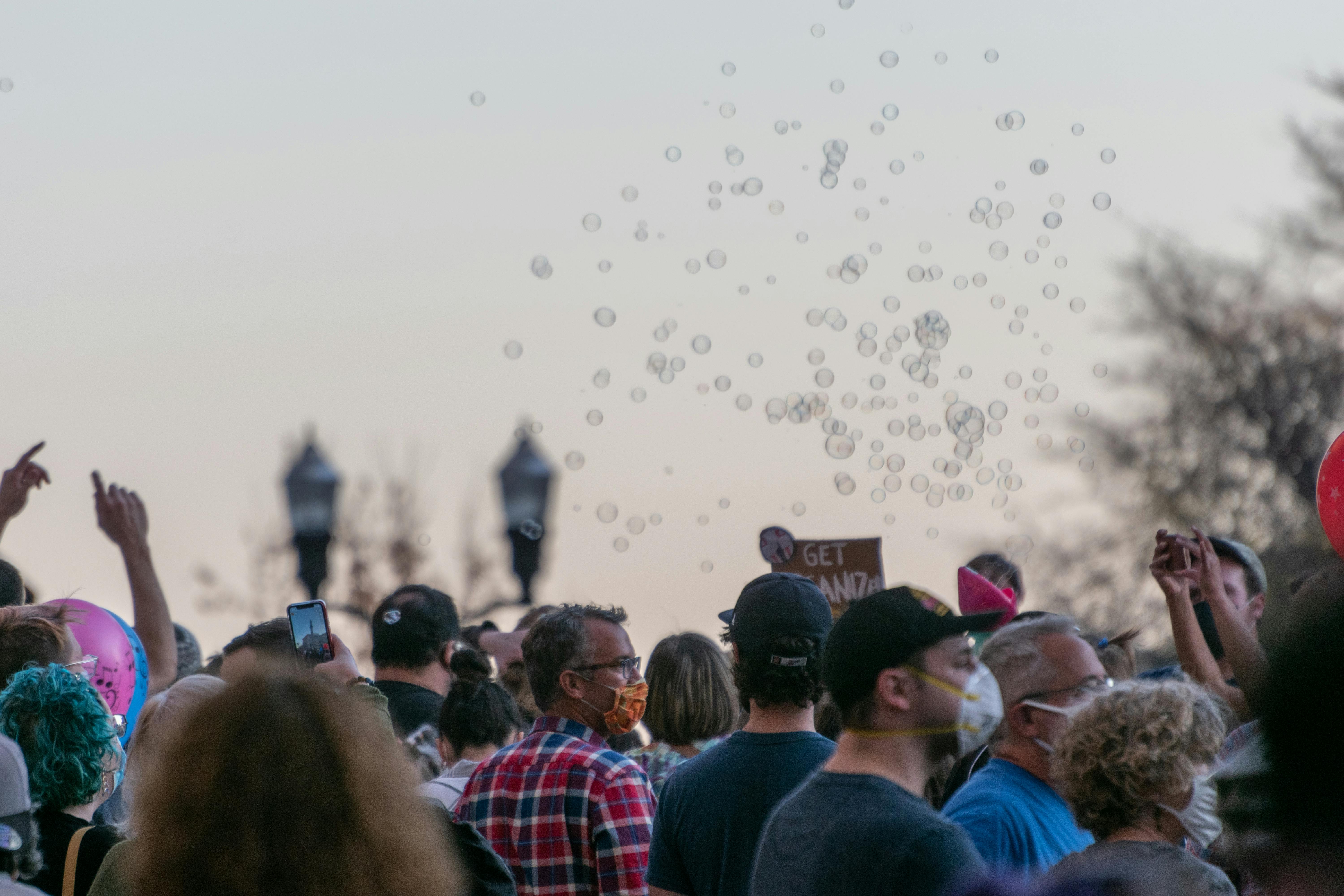 People Blowing Bubbles at Protest · Free Stock Photo