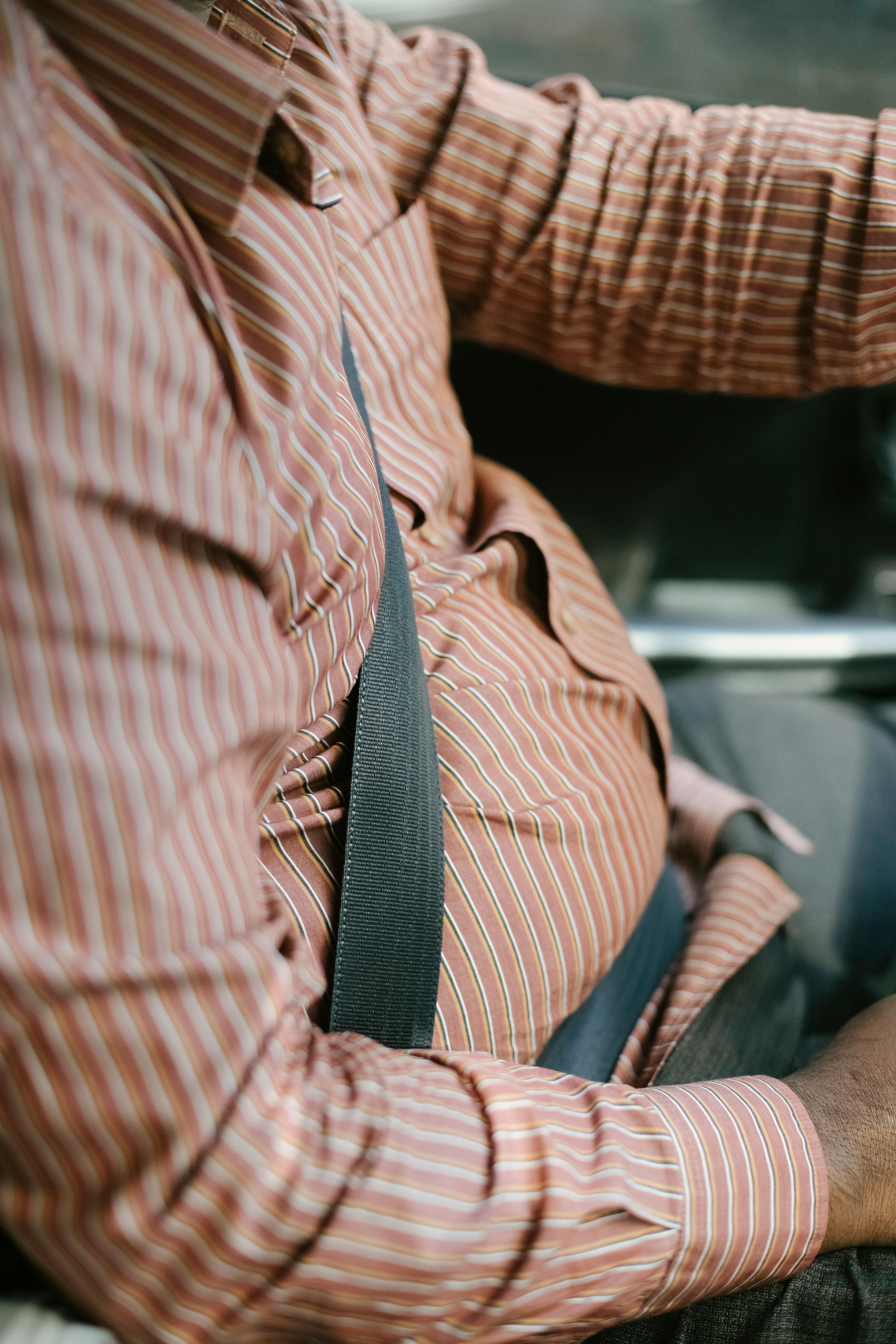 Faceless ethnic driver in ornamental shirt in transport · Free Stock Photo