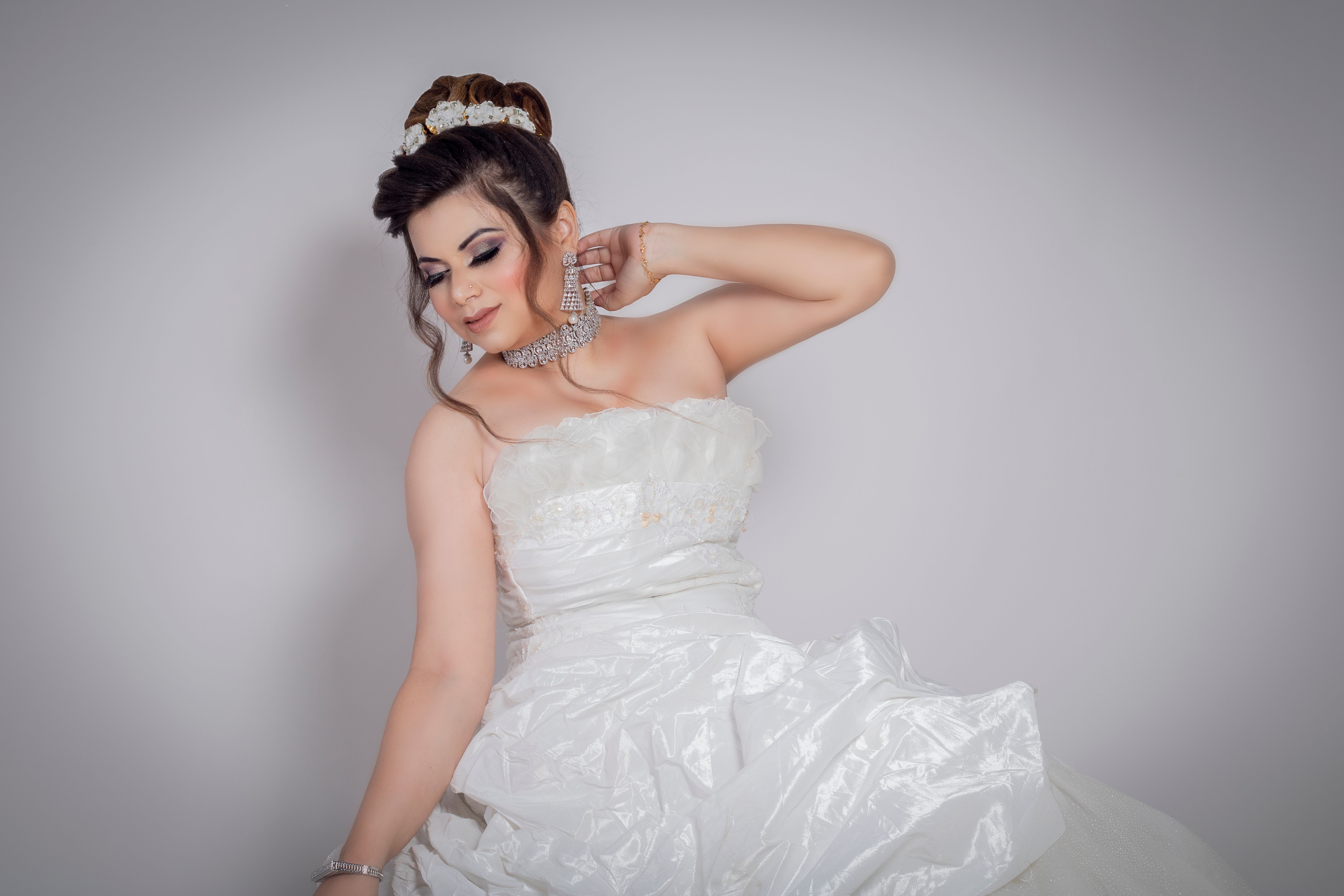 Graceful woman in dress in dark studio · Free Stock Photo