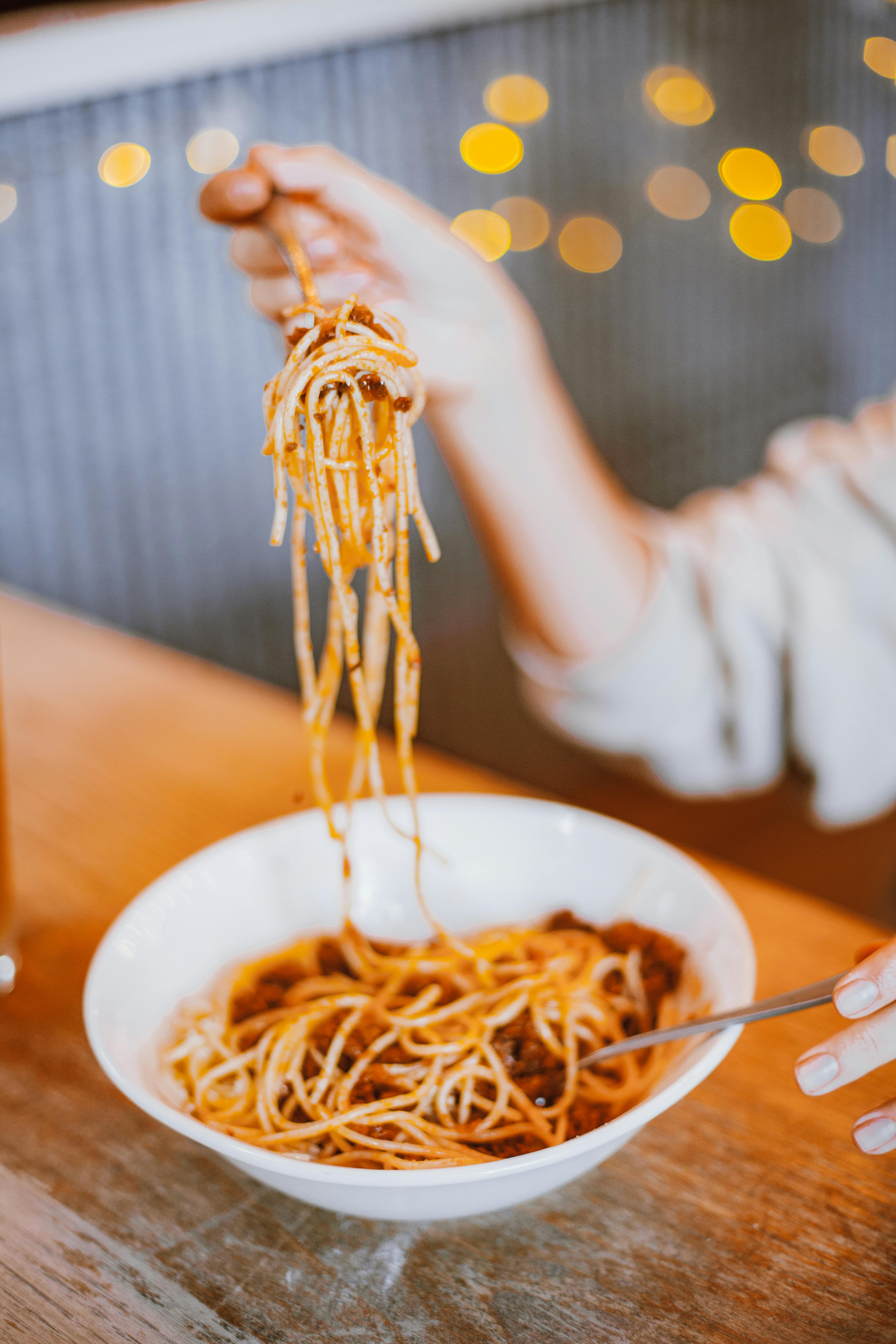 Hand with Spaghetti · Free Stock Photo