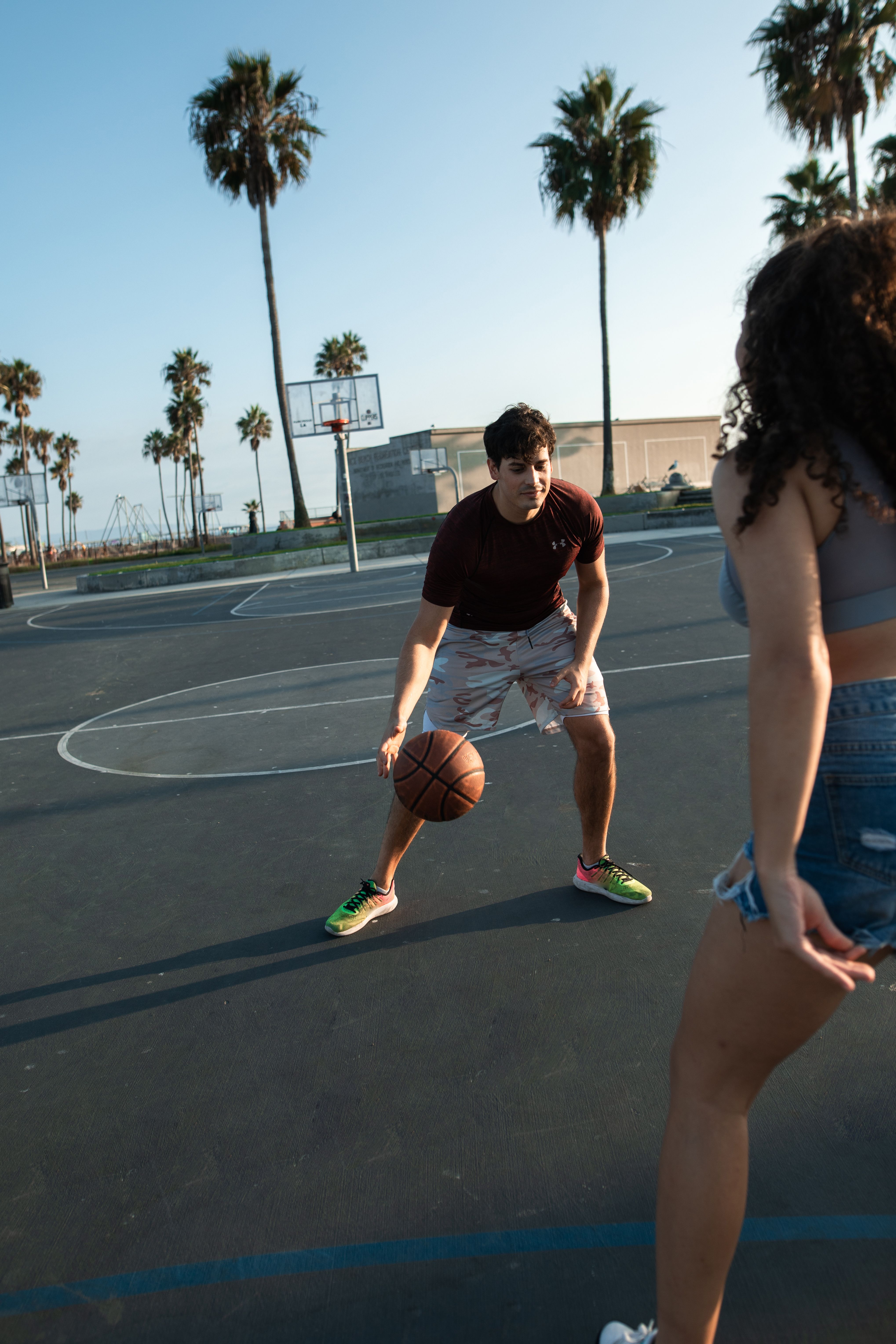 Man Dunking a Ball into the Basket on an Outdoor Basketball Court ...