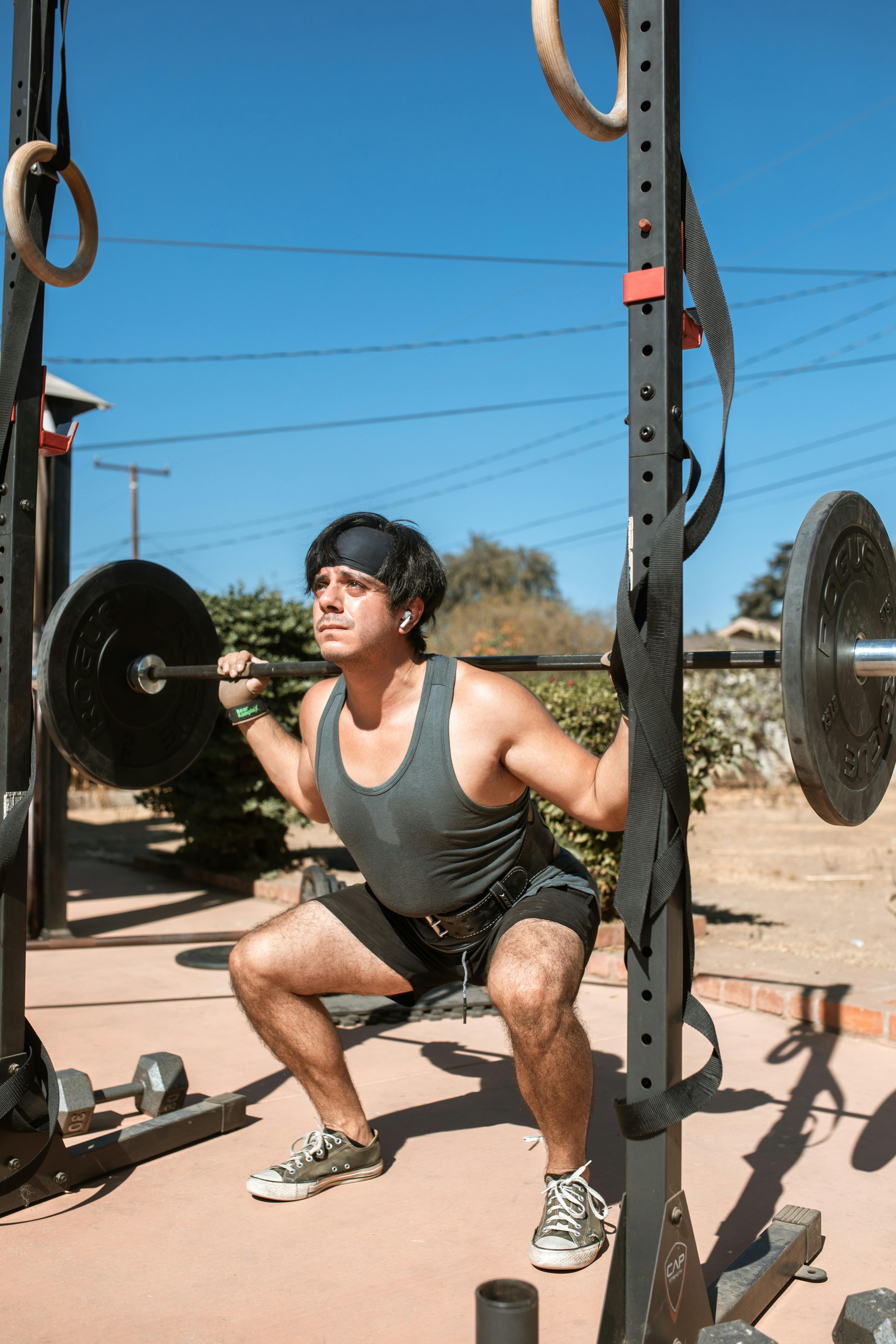 Man Lifting a Barbell · Free Stock Photo