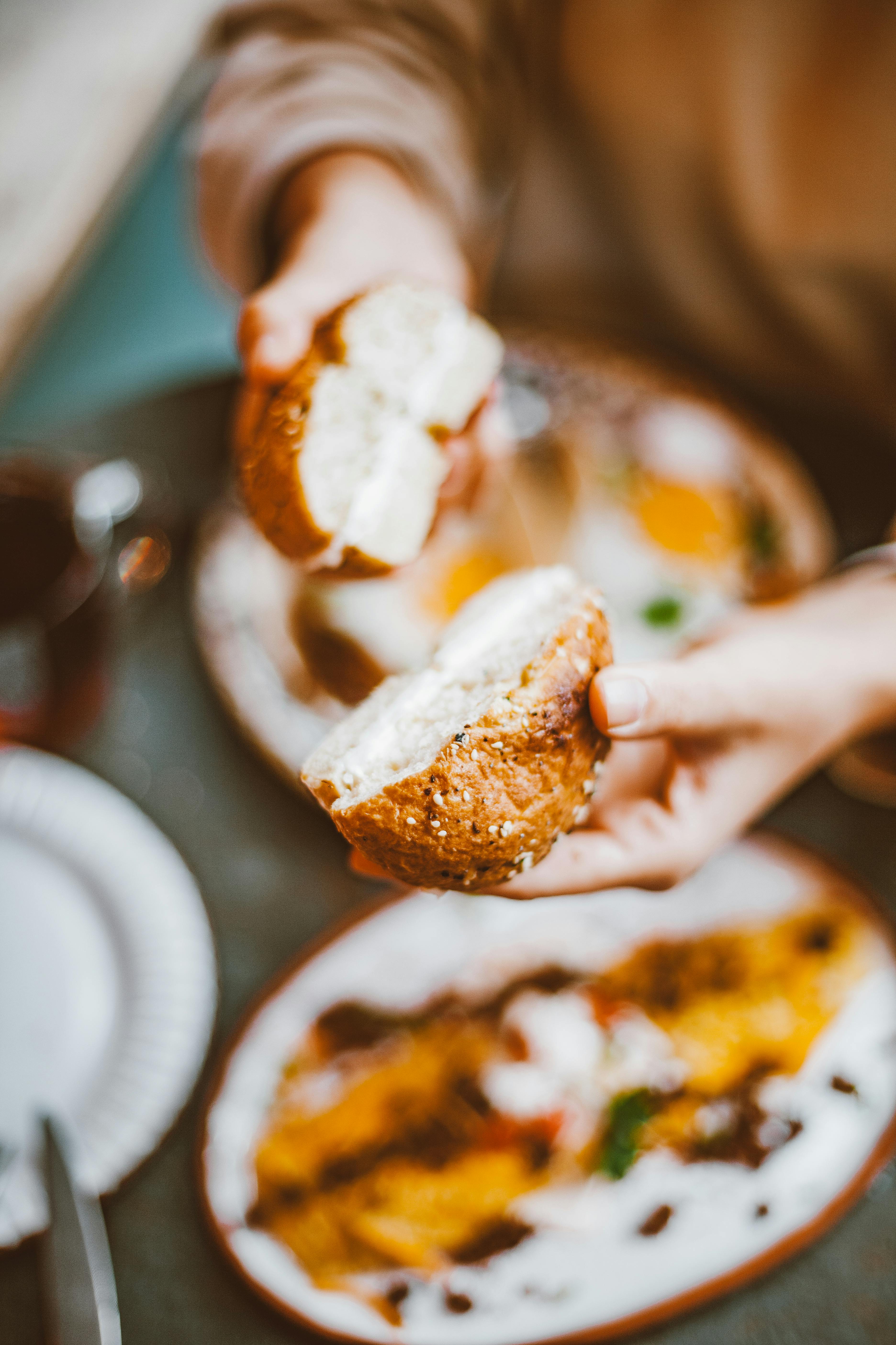 Personholding Bread in Tilt Shift Lens · Free Stock Photo