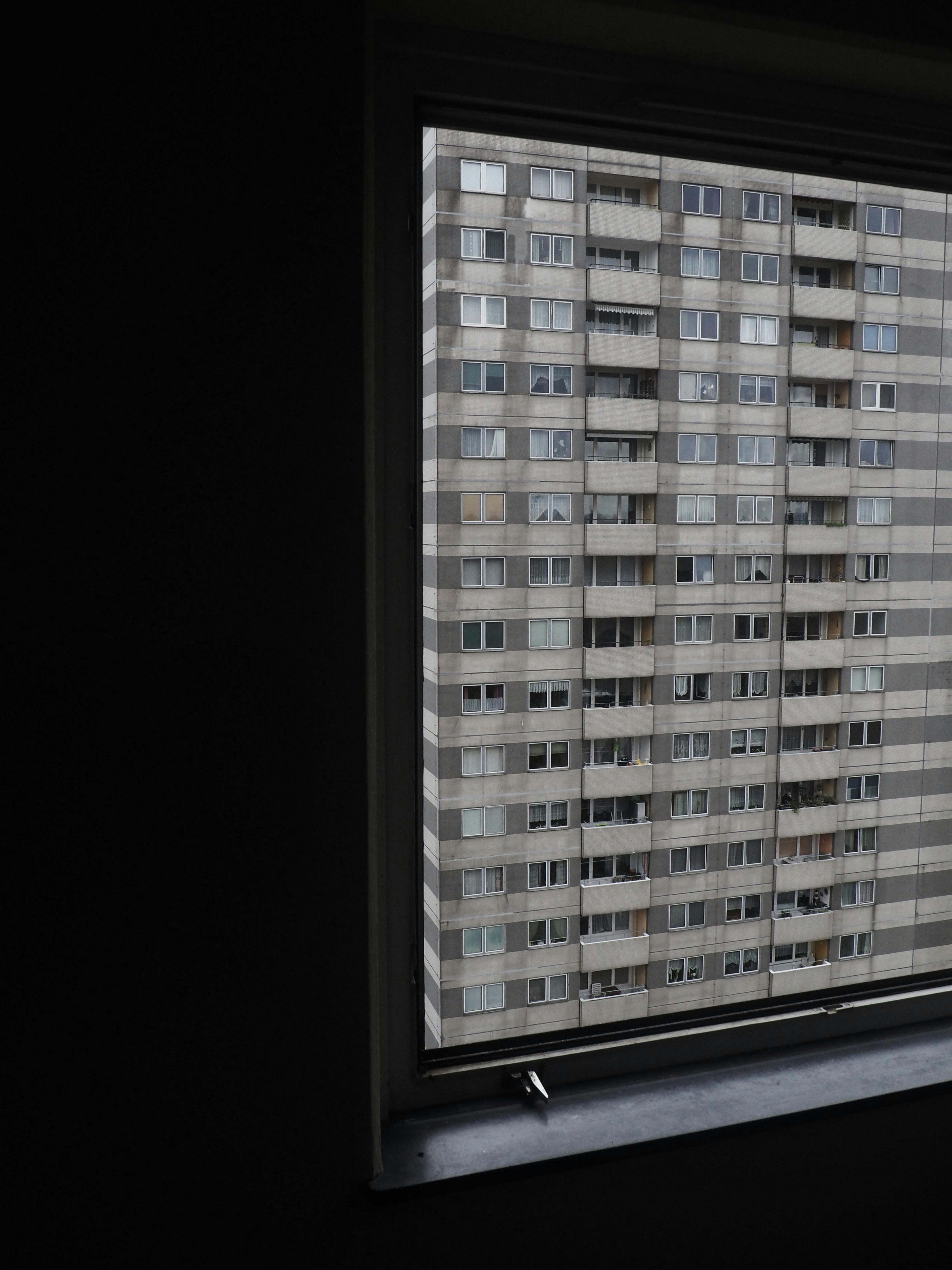 A View of a Building Through a Window · Free Stock Photo