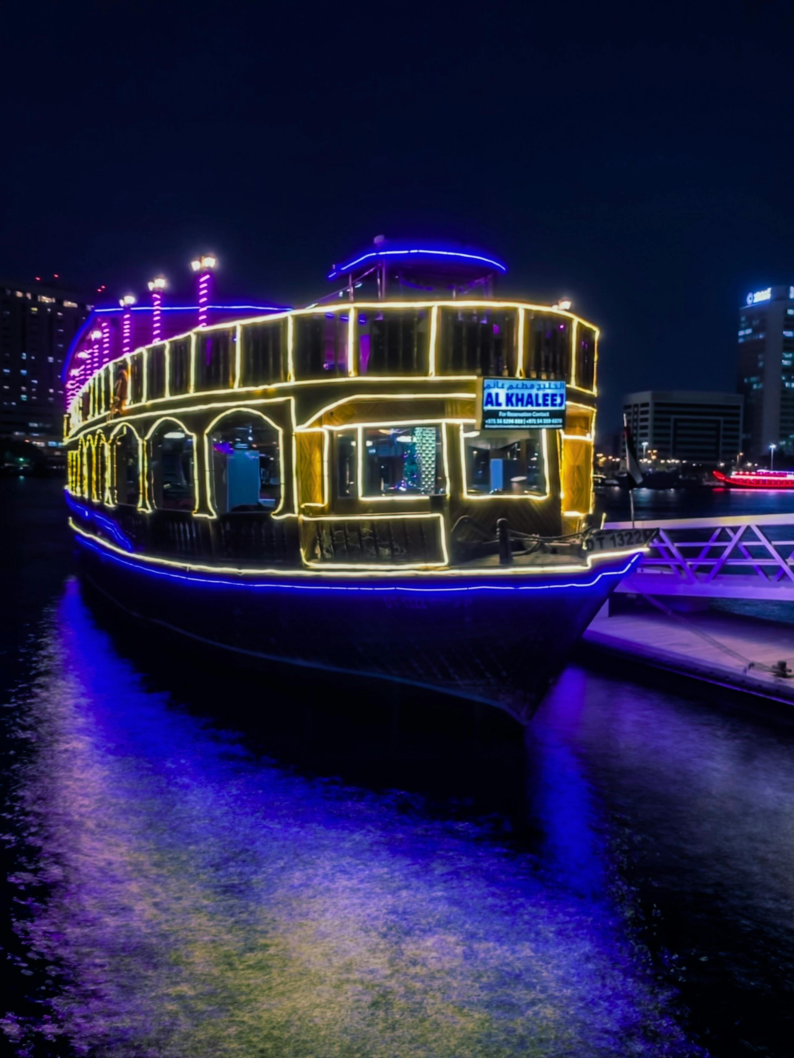 Illuminated Boat on Water at Night · Free Stock Photo