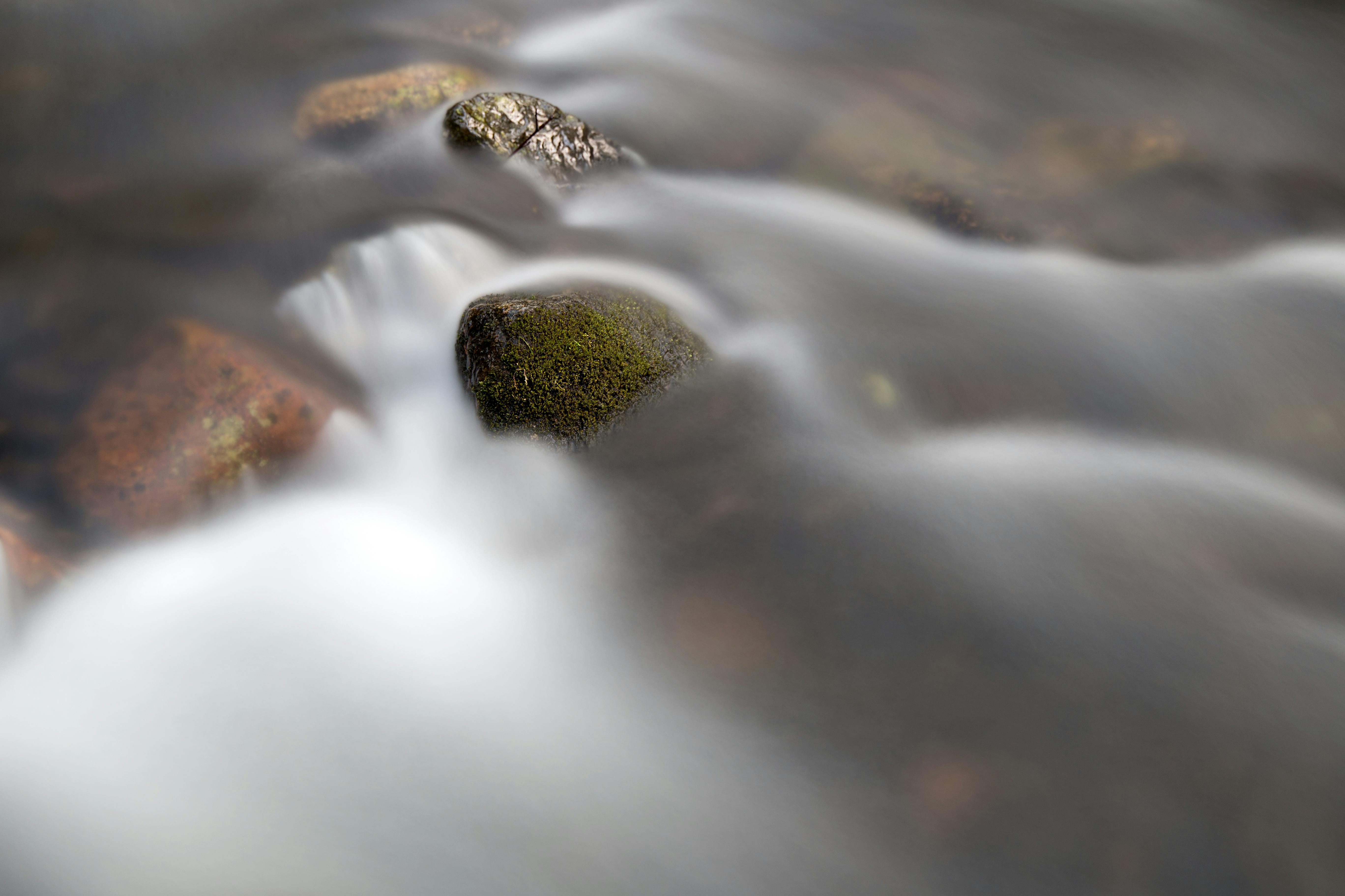 Body of Water With Rocks · Free Stock Photo