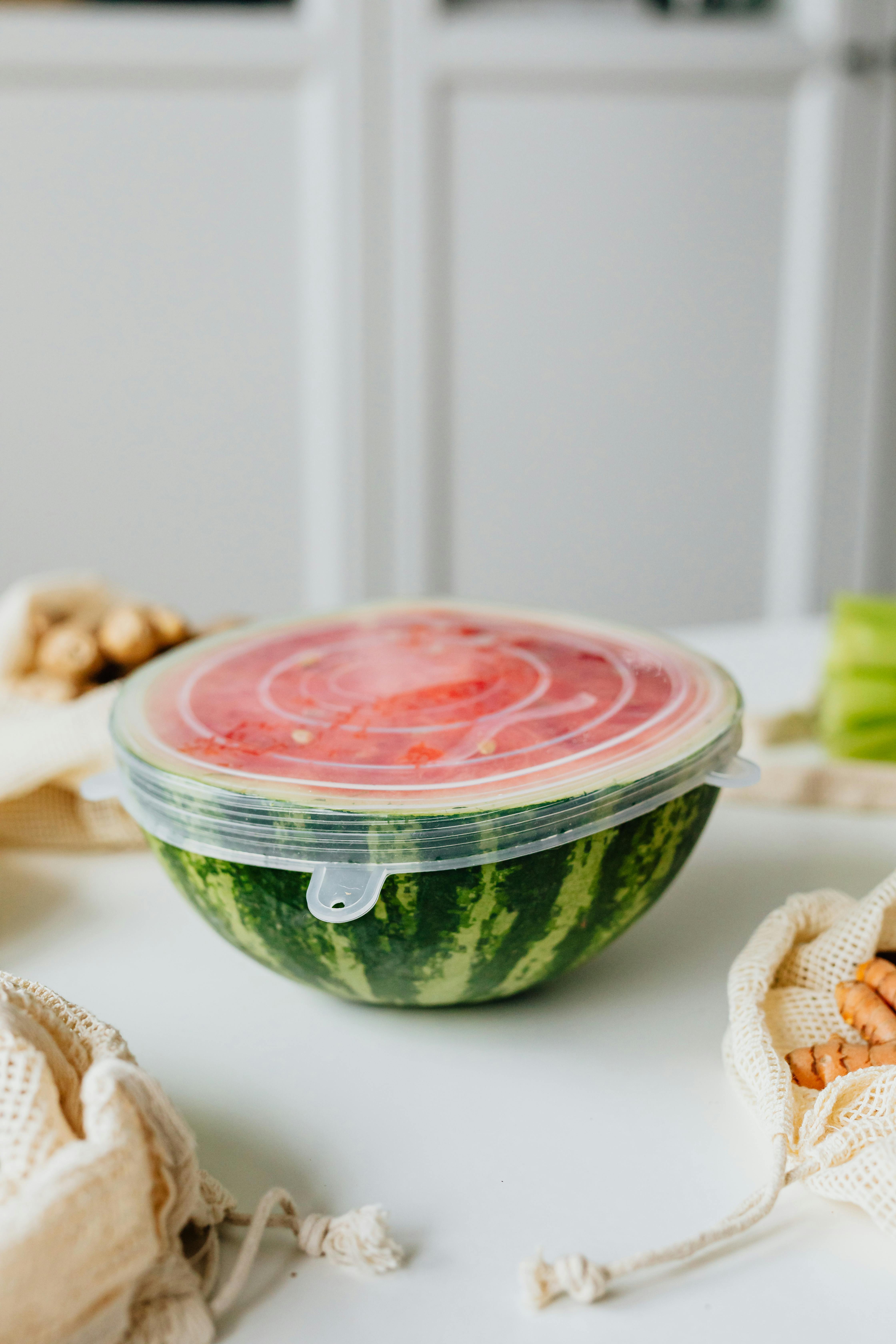 Sliced Watermelon Covered with Plastic Lid · Free Stock Photo