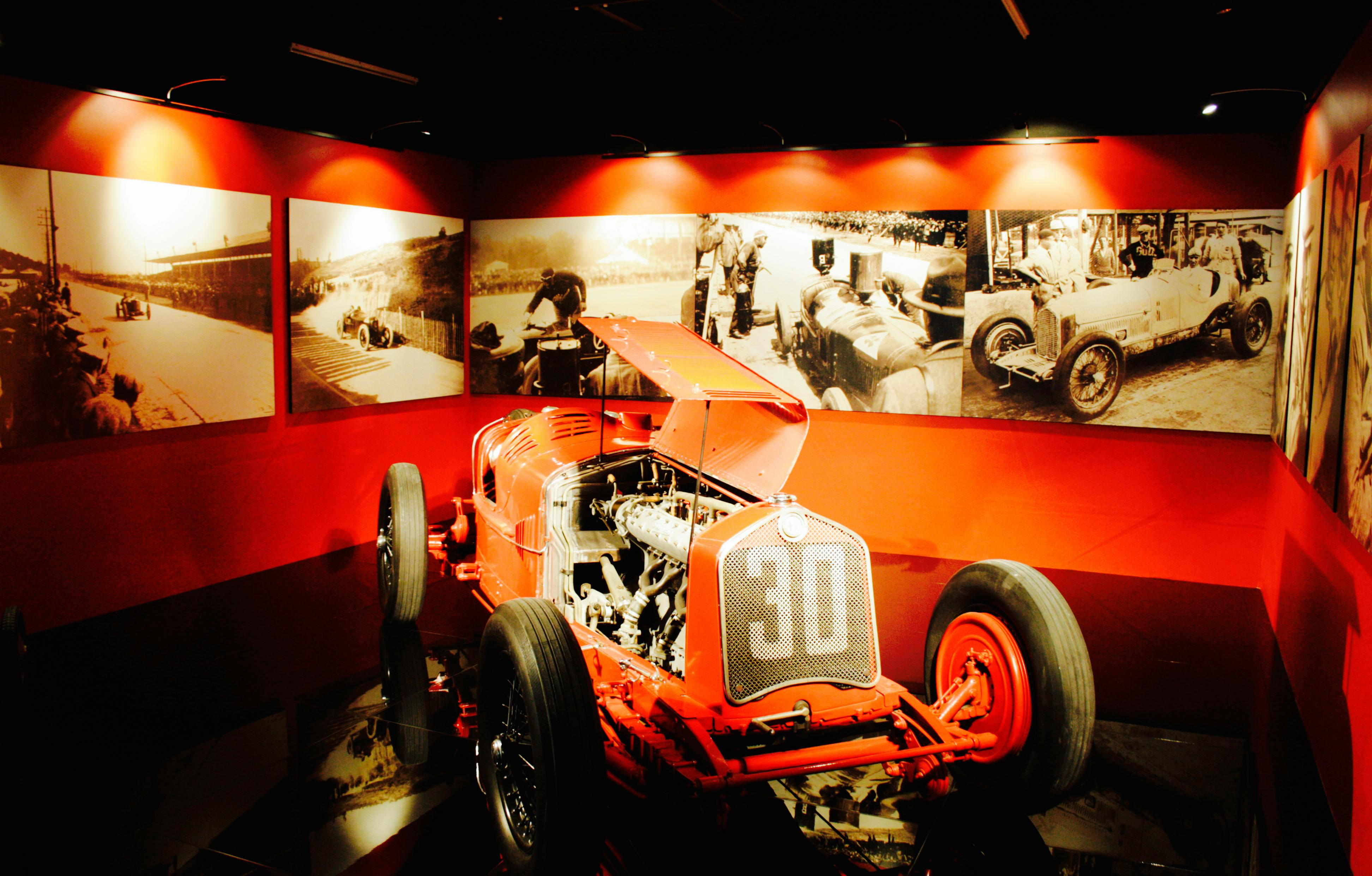 Red Vintage Car Parked Inside a Museum · Free Stock Photo