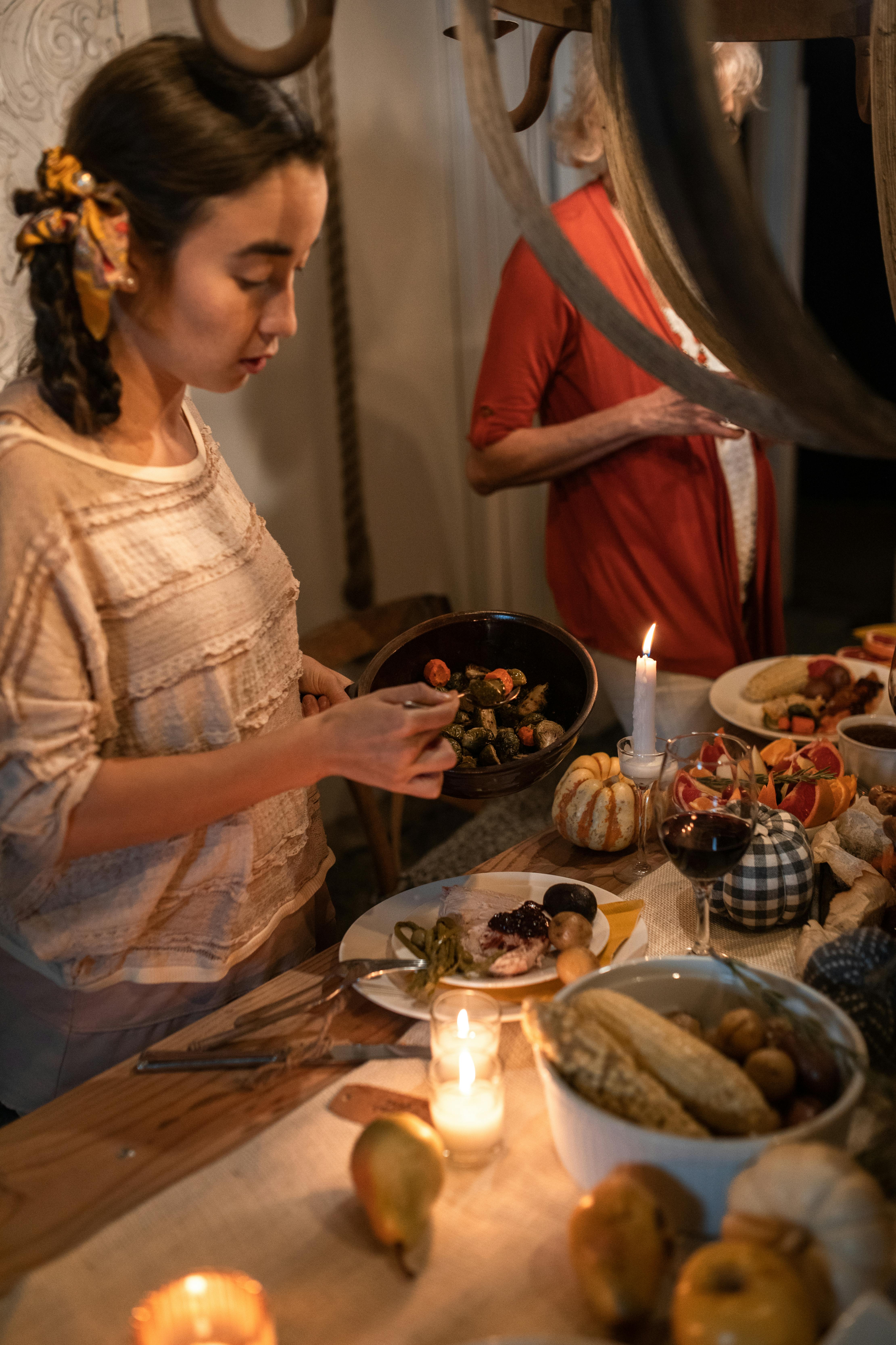 Woman Putting Food on Her Plate · Free Stock Photo