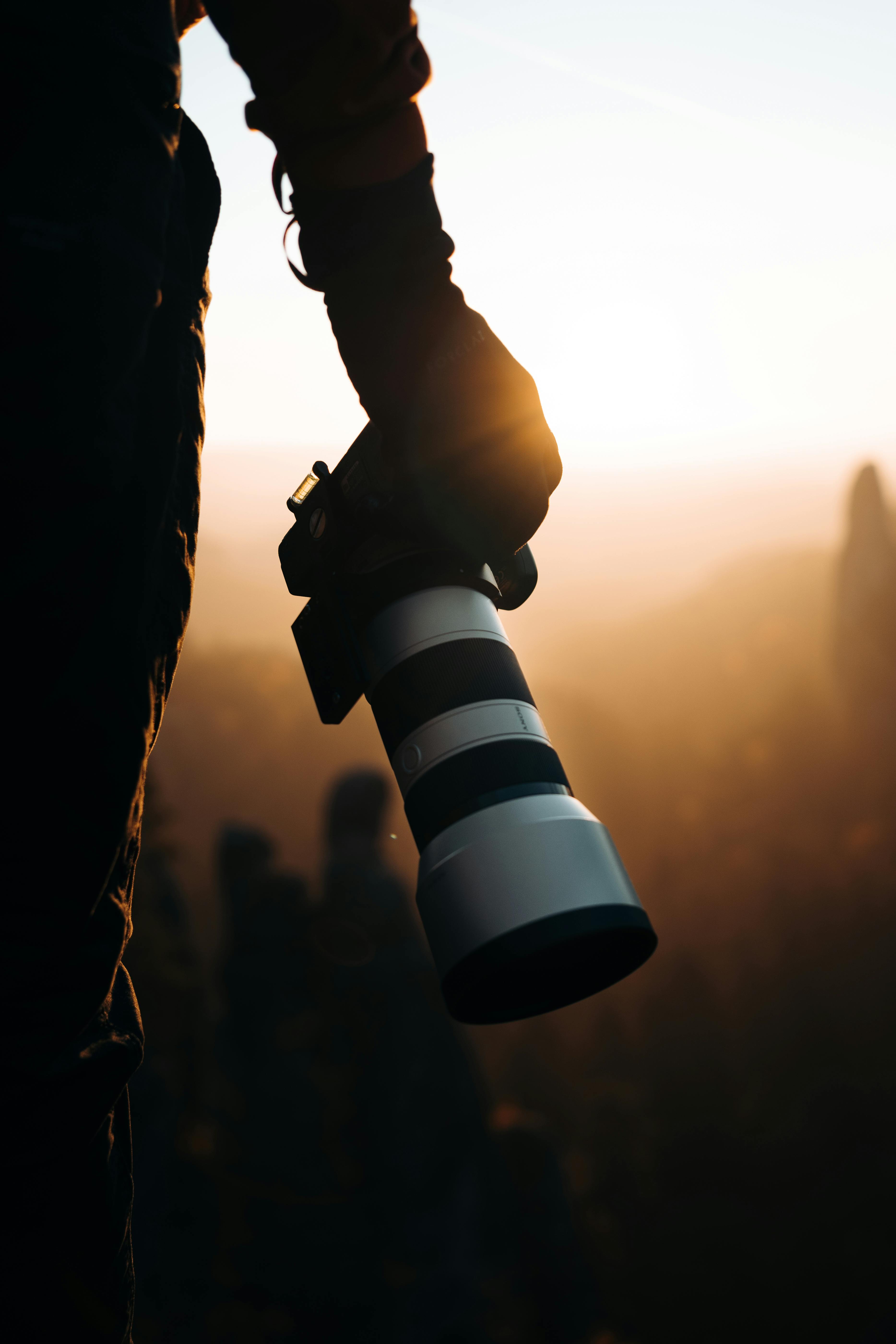 A Person Holding DSLR Camera · Free Stock Photo