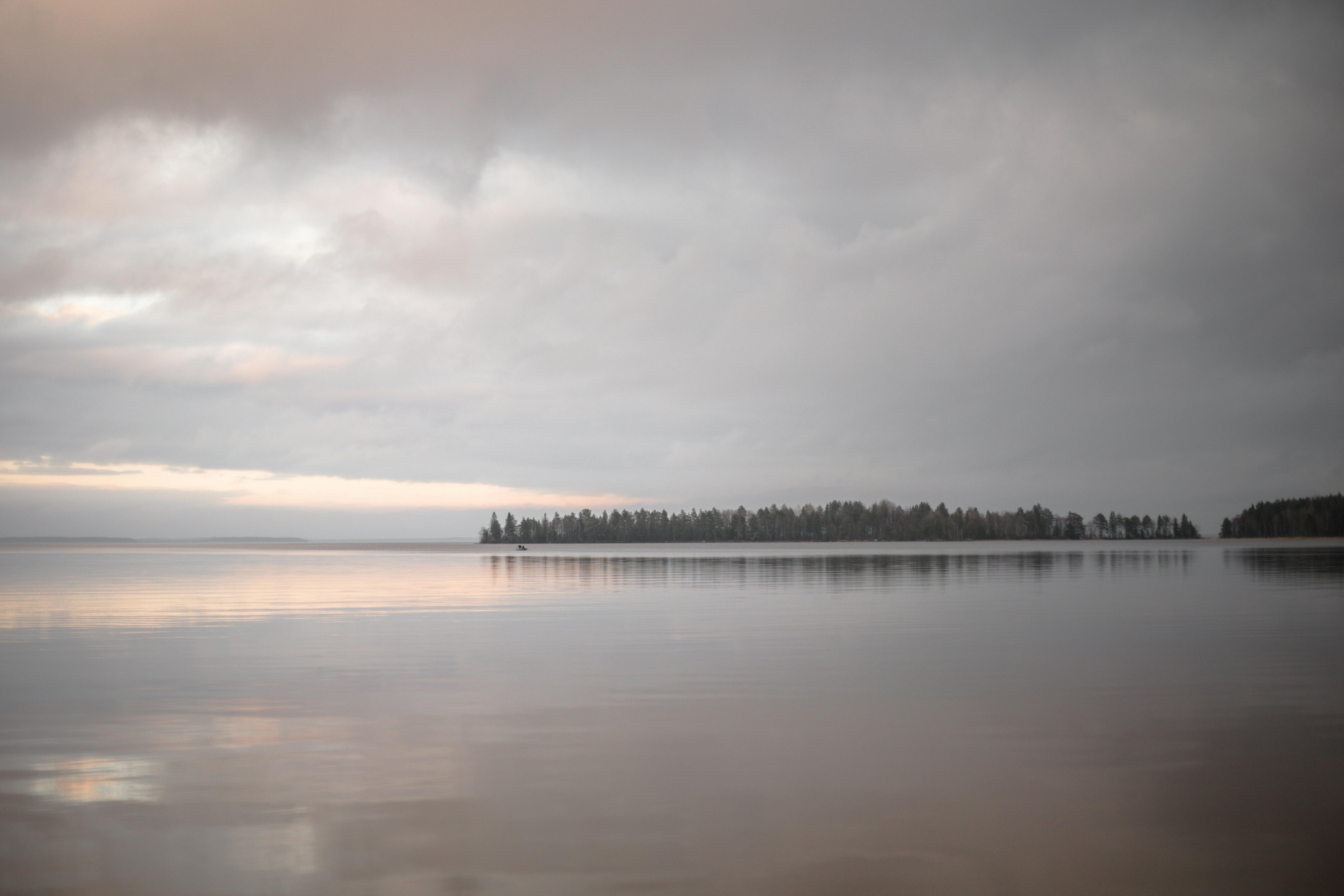 Clouds Reflecting in a House Window at Dawn · Free Stock Photo