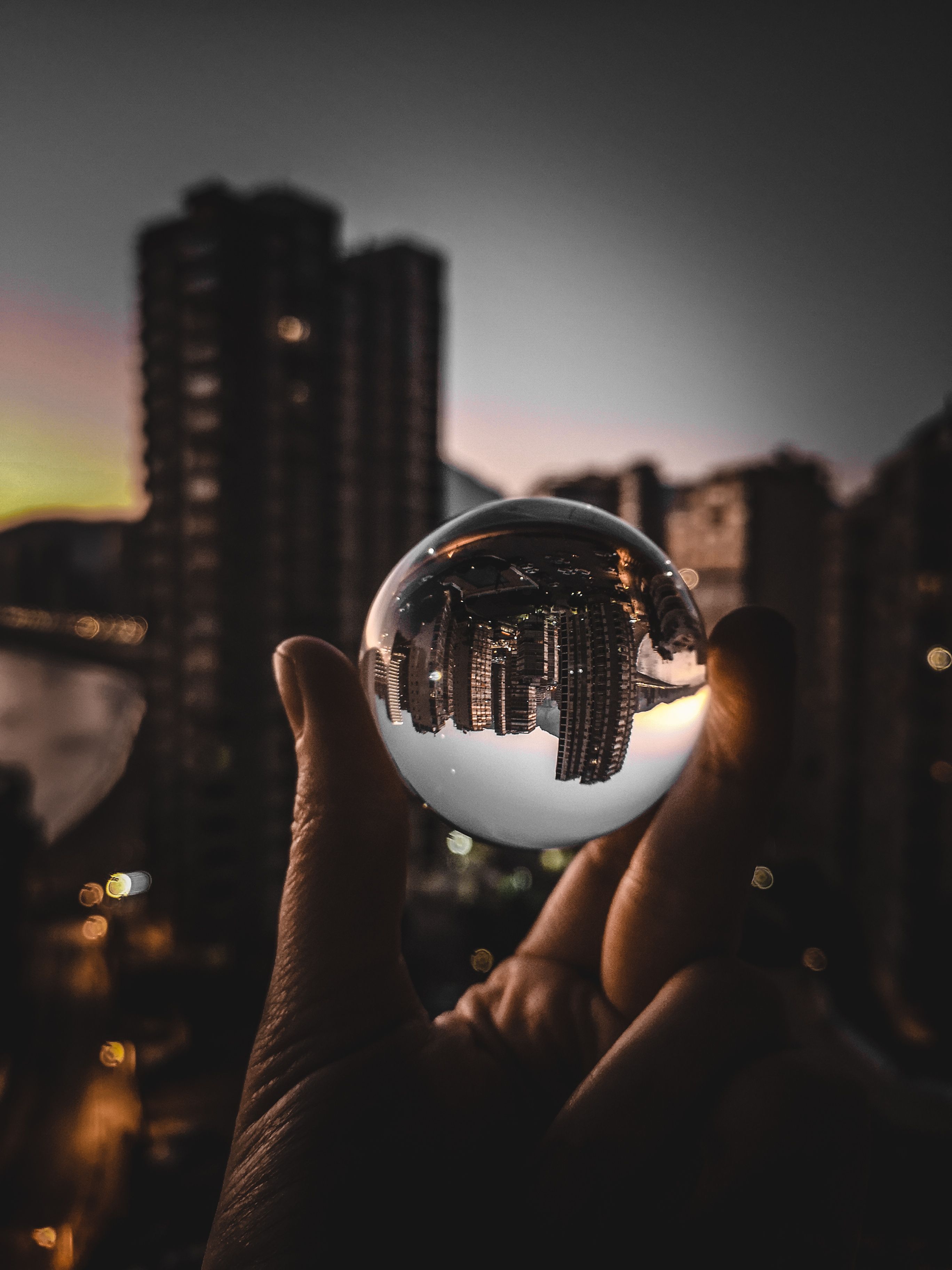 A Person Holding a Clear Glass Ball · Free Stock Photo