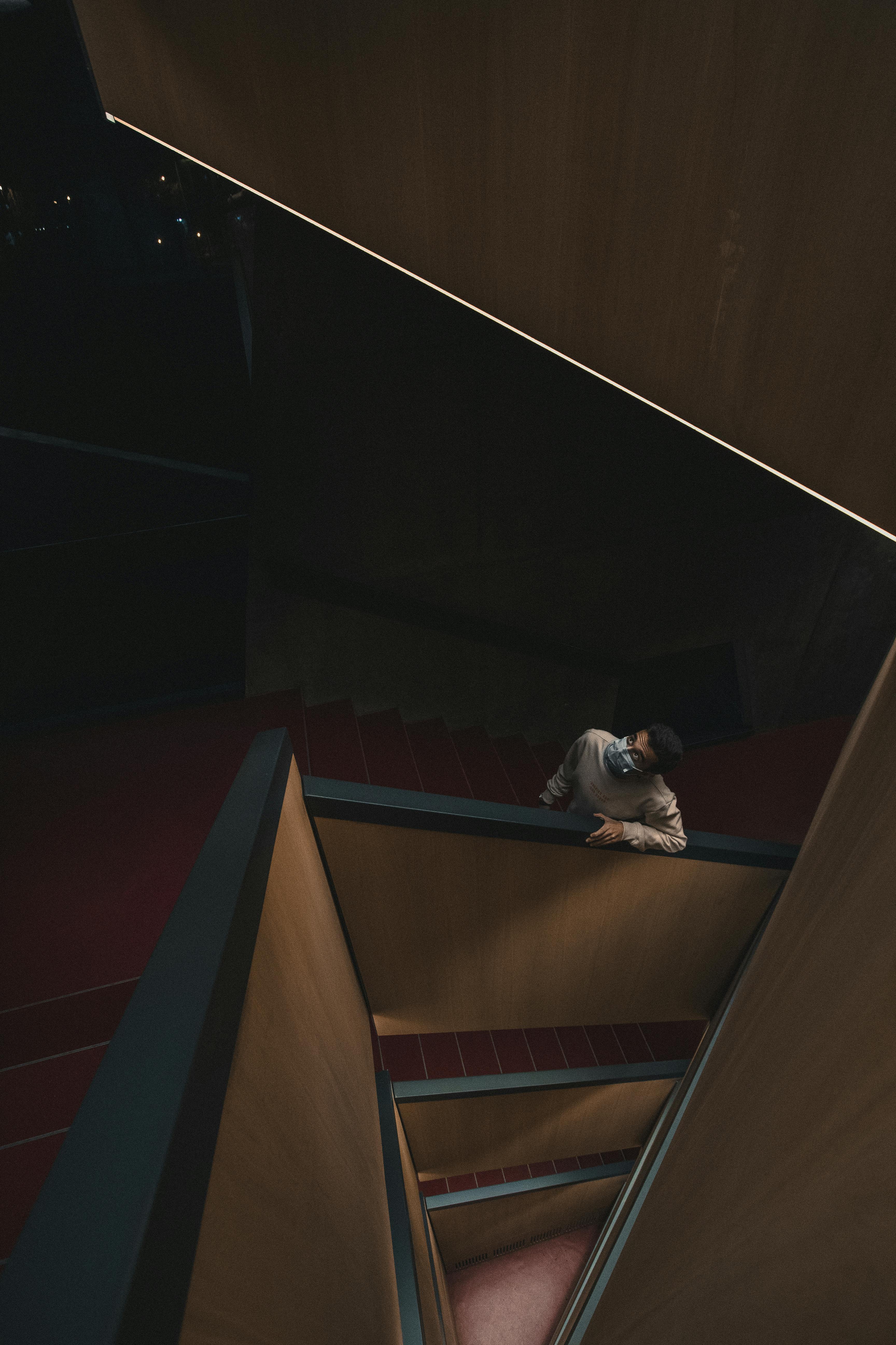 A Man Looking Up the Stairs · Free Stock Photo