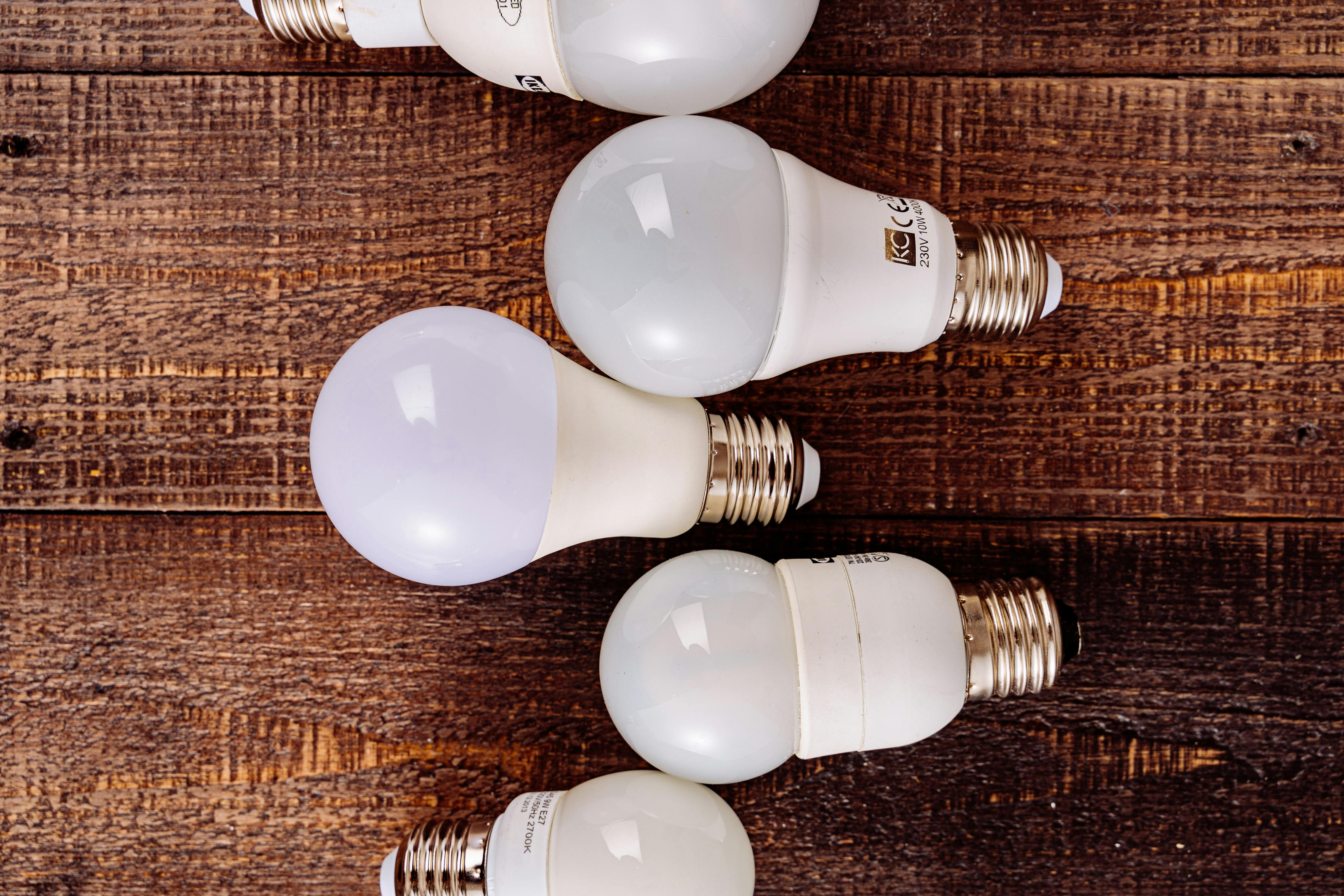 Light Bulb on White Surface · Free Stock Photo