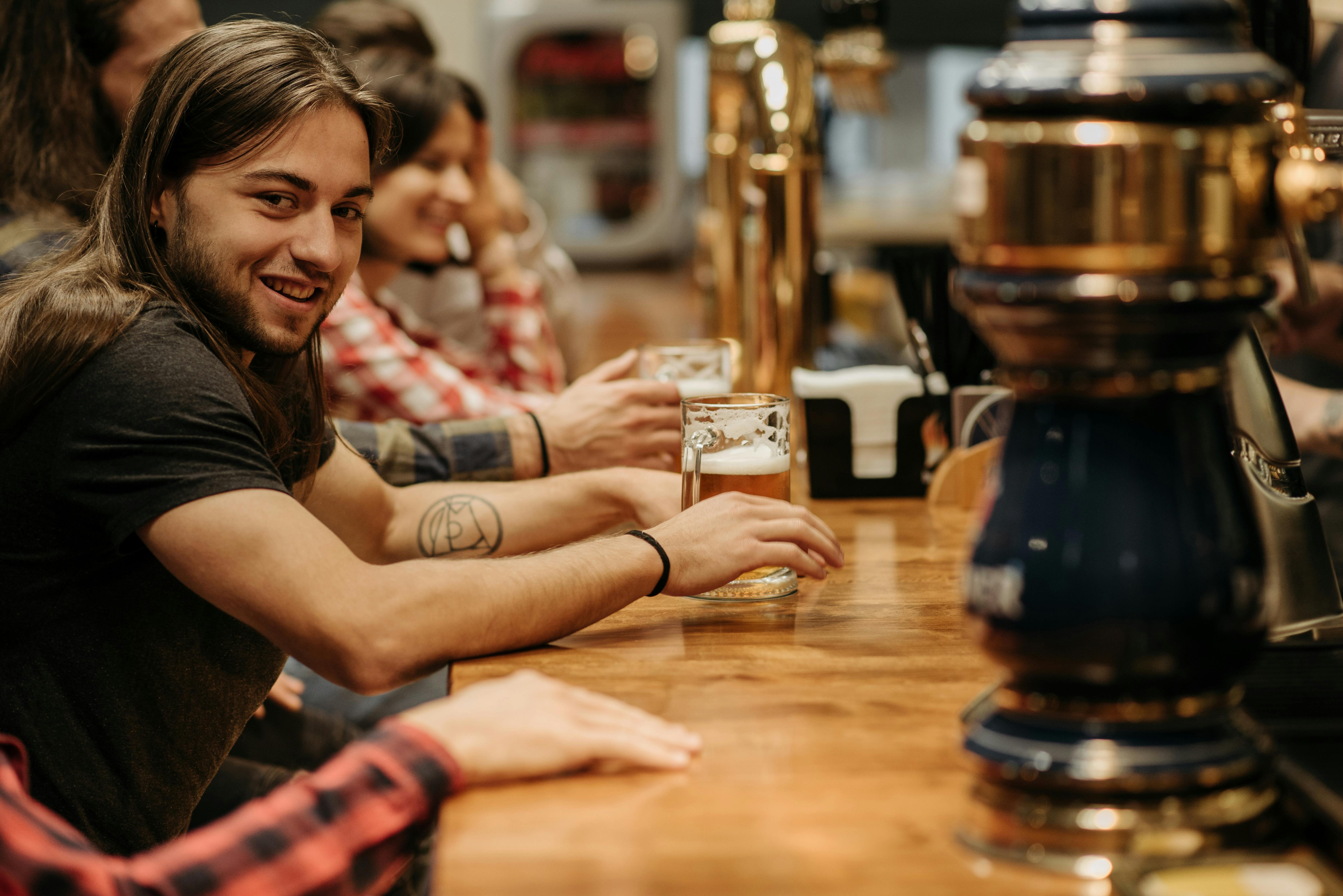 Customer Sitting at Bar Counter · Free Stock Photo