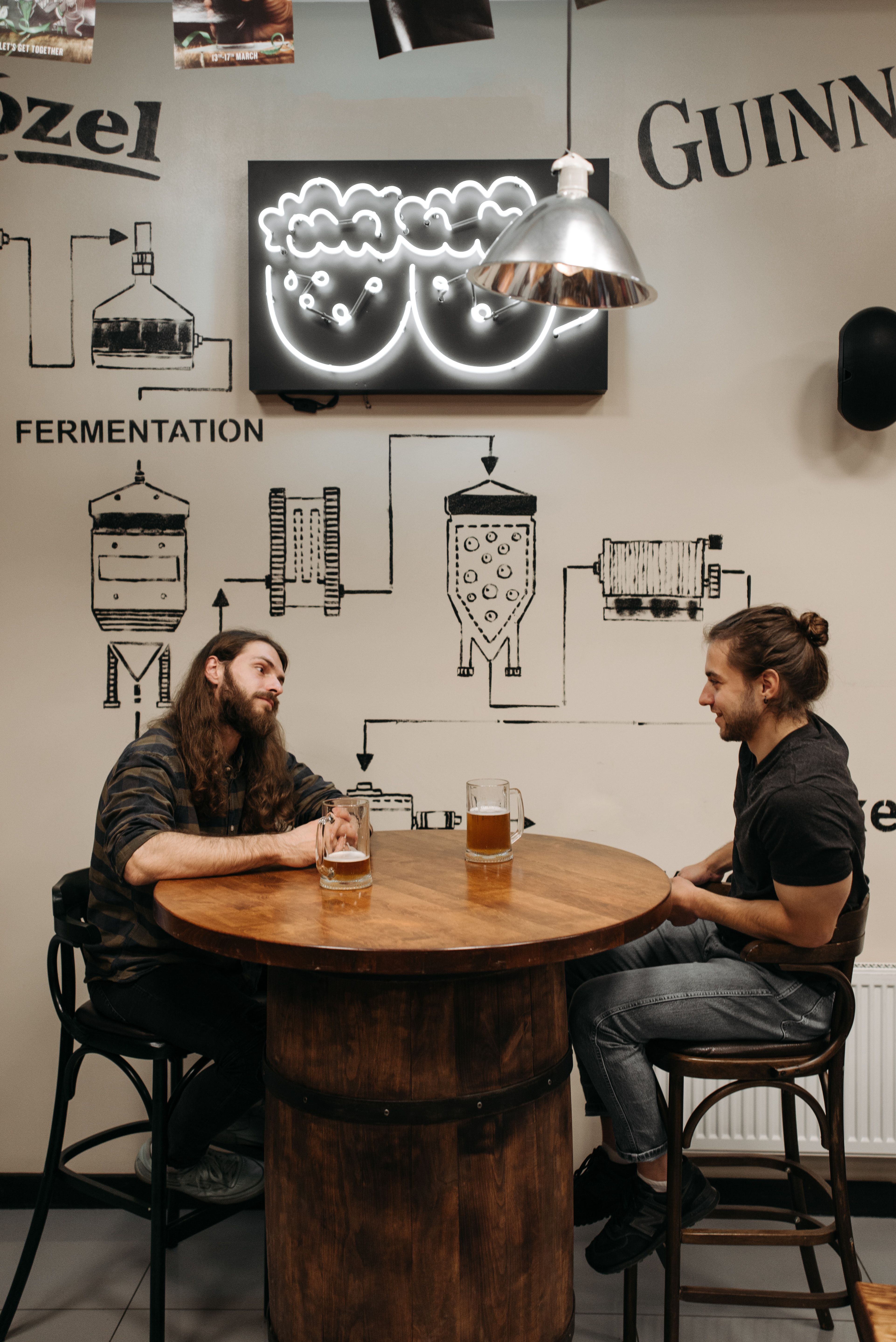 Two Men Talking in the Bar · Free Stock Photo