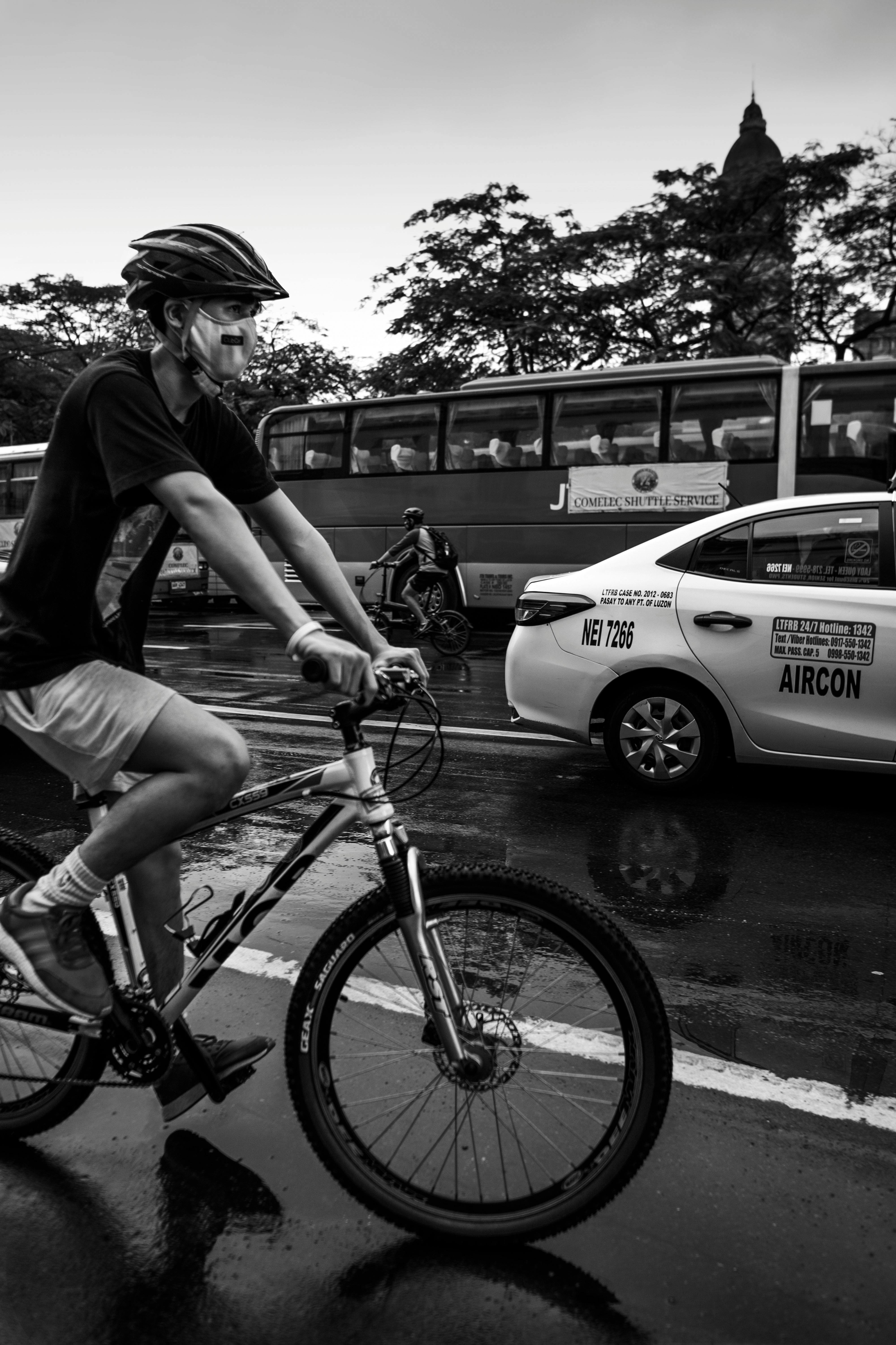 Grayscale Photography of Person Riding Bicycle · Free Stock Photo