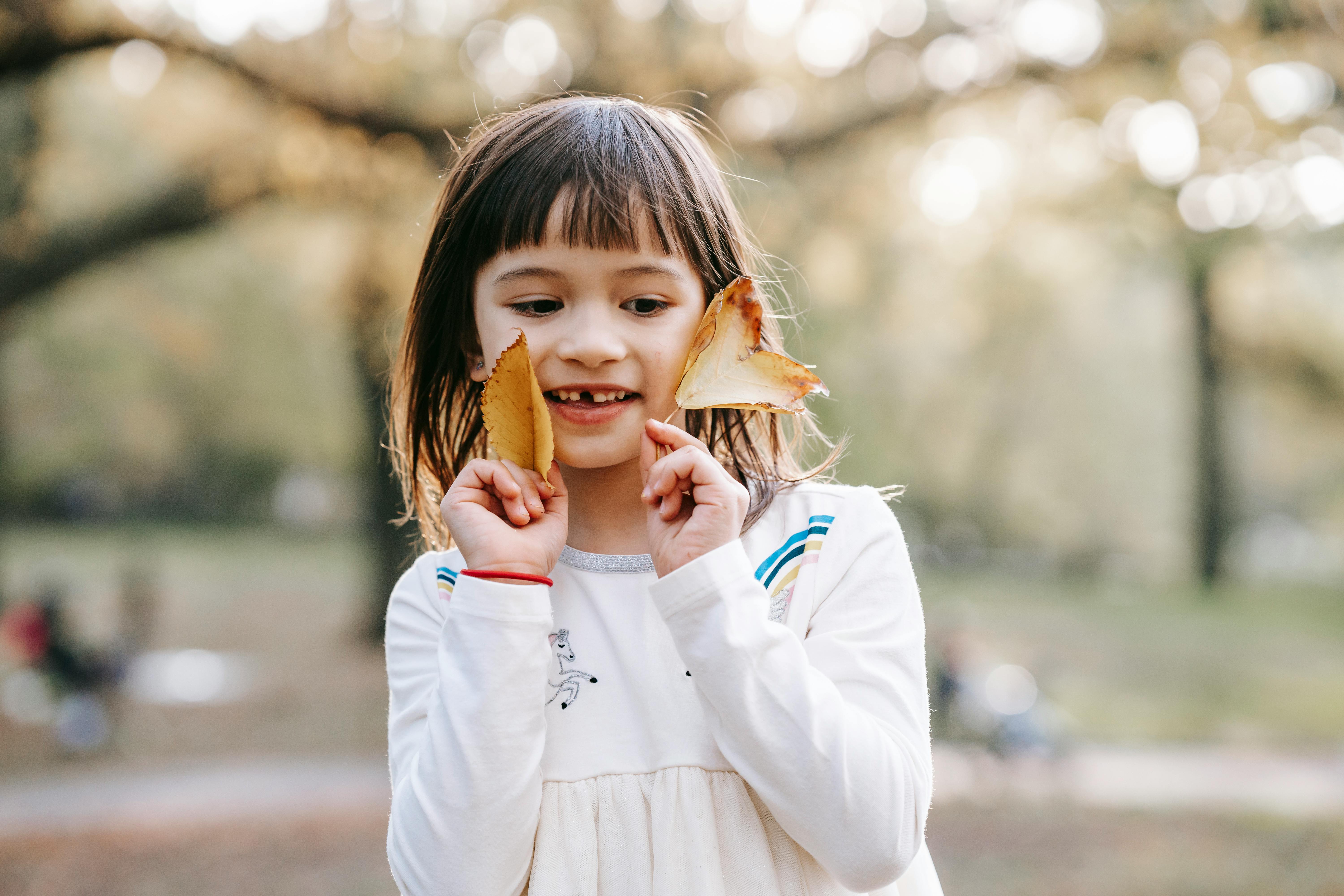 Cute preschool girl standing in nature · Free Stock Photo