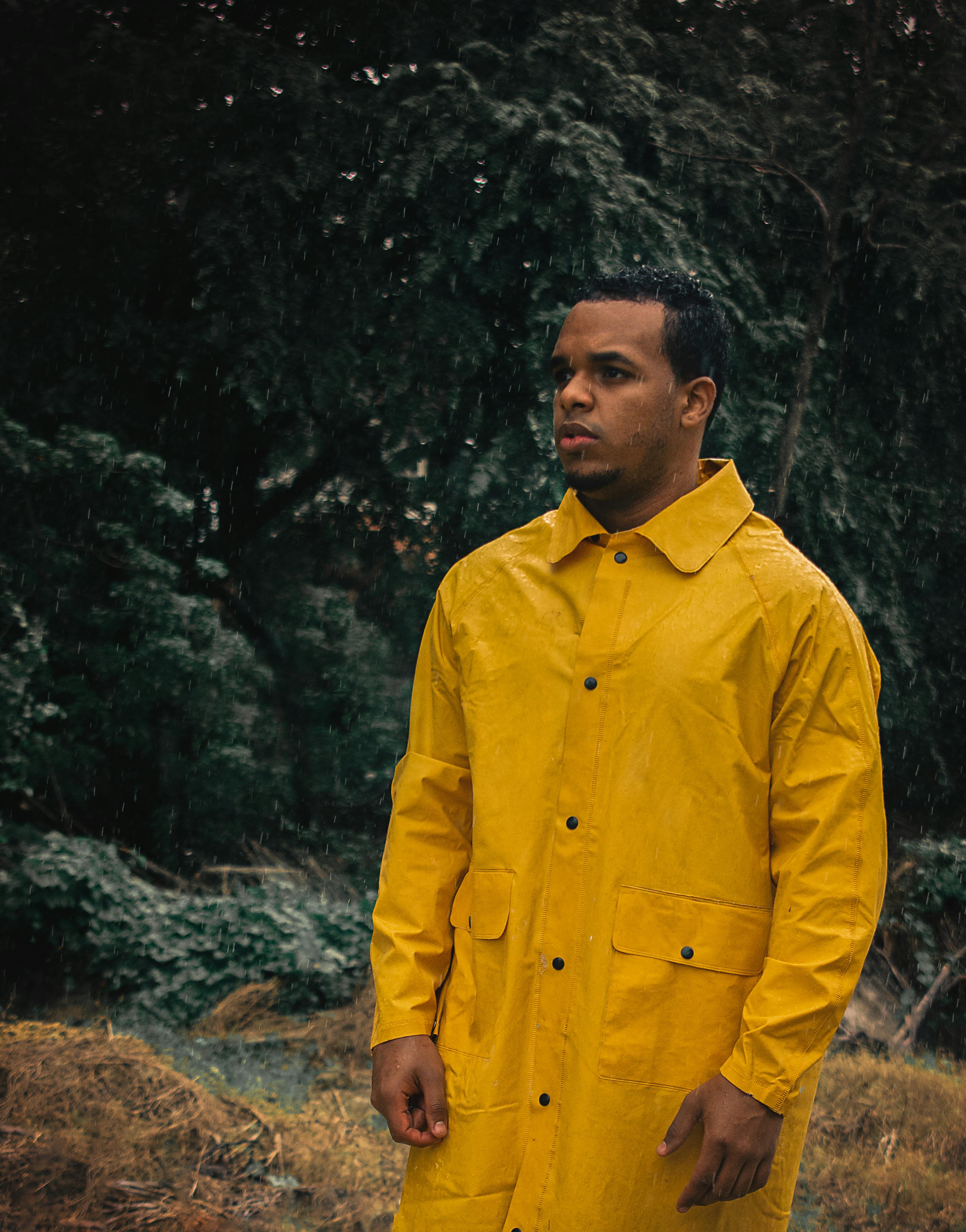 A Man in Yellow Coat Standing · Free Stock Photo