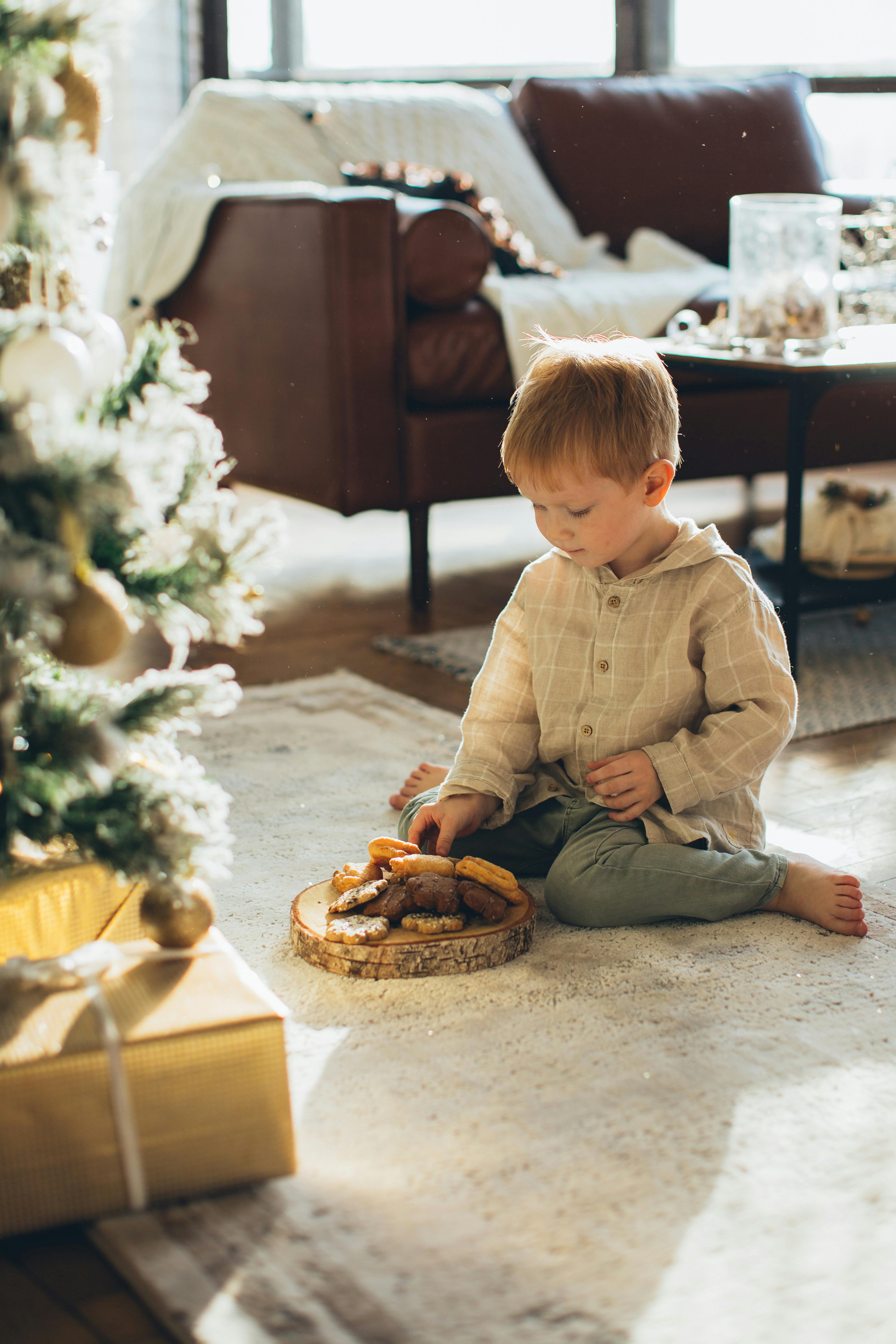 Selective Focus Photography of Boy Beside Table With Cookies · Free ...