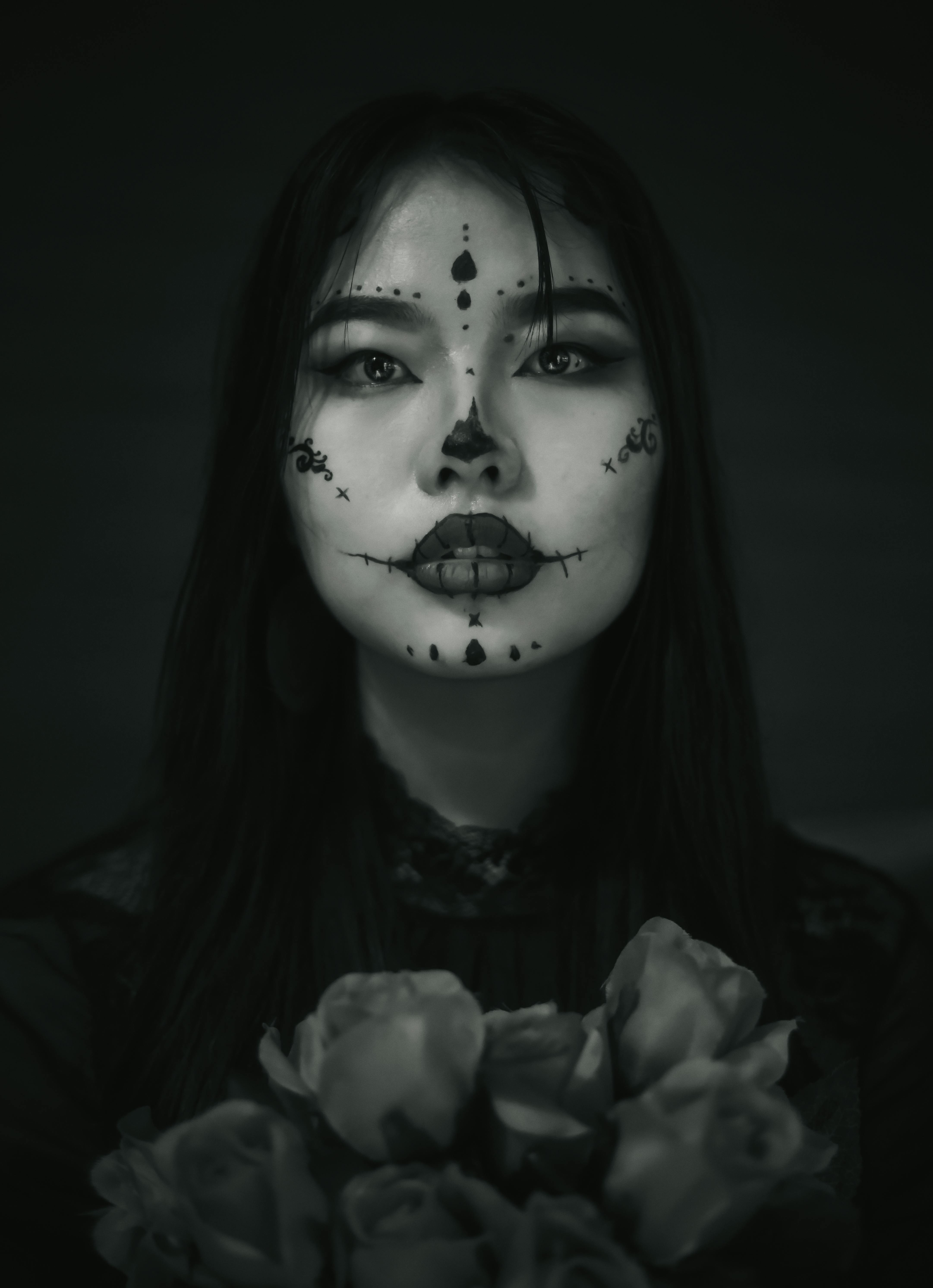 A Woman Putting Makeup on Her Face · Free Stock Photo