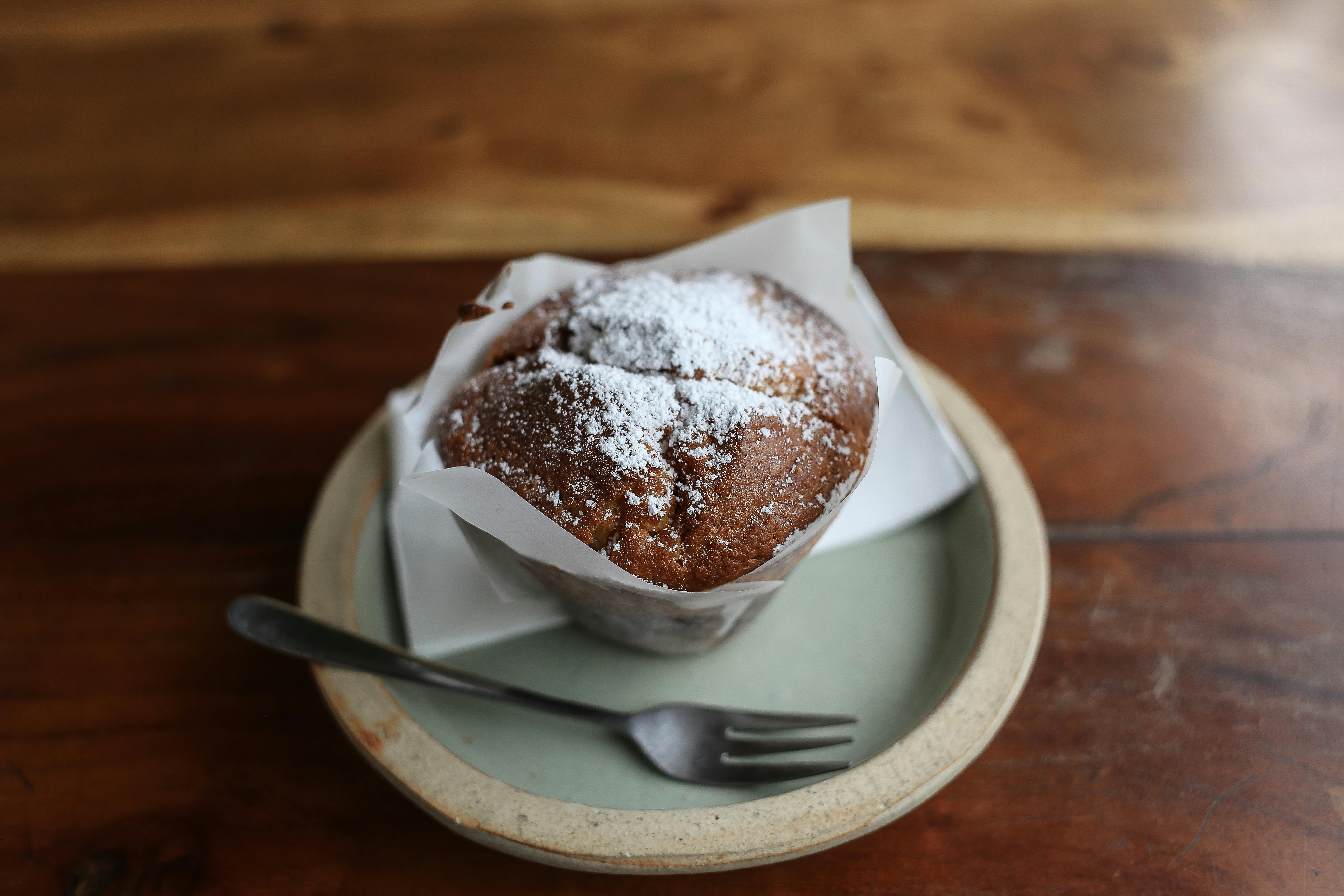 Brown Table and Muffin on Teal Plate · Free Stock Photo